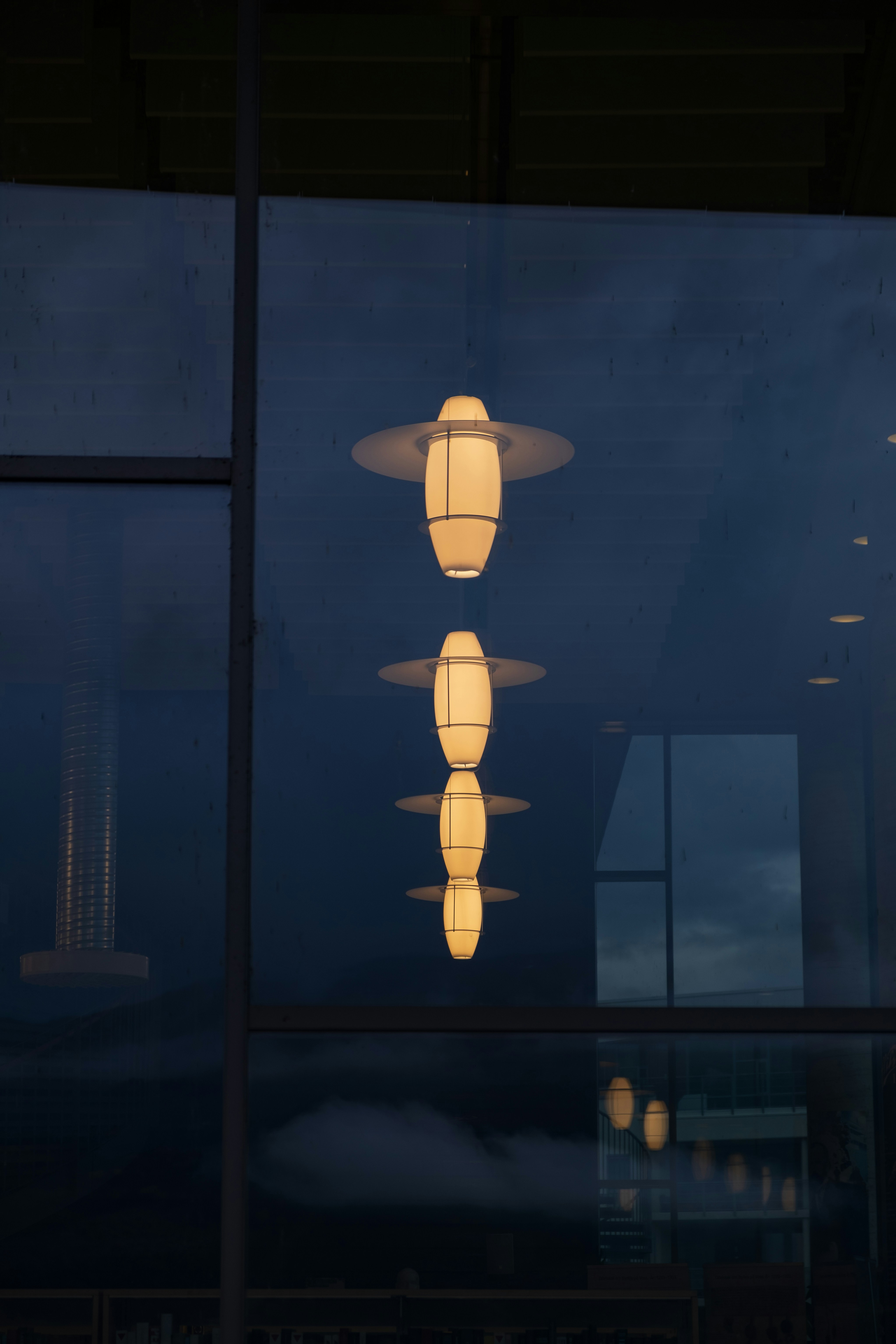 Blue Facade Lanterns: Echoes of a Vertical Glow