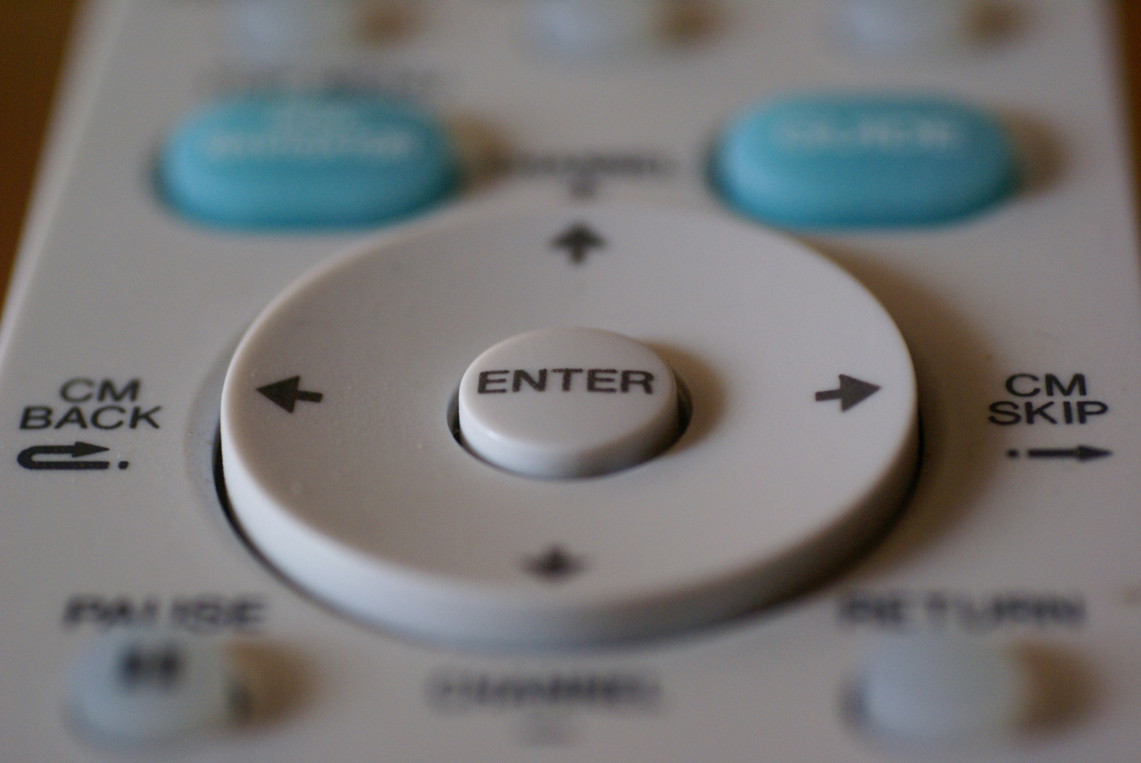 A close up of a remote control on a table photo – Free Electronics ...