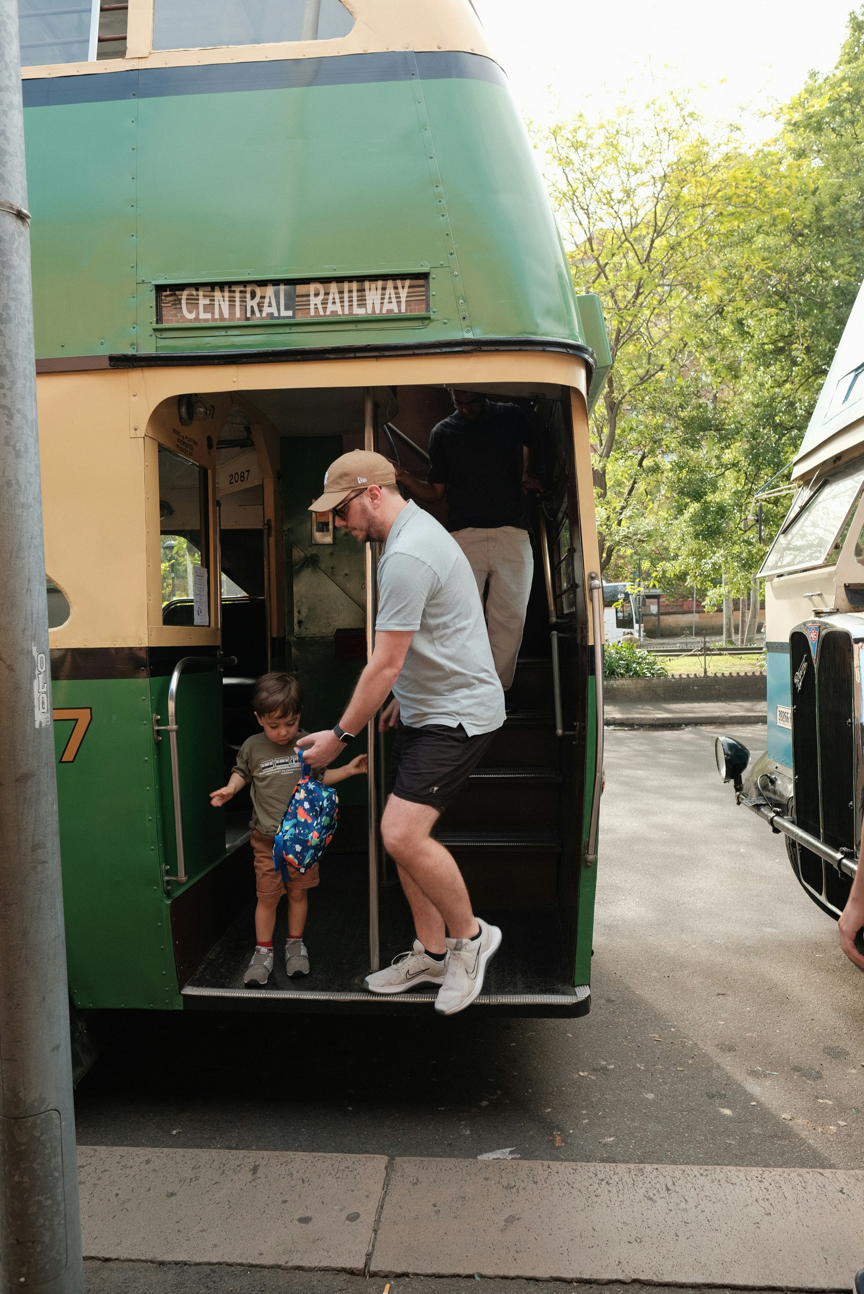 Step into Nostalgia: a man helps a child off a vintage Central Railway bus