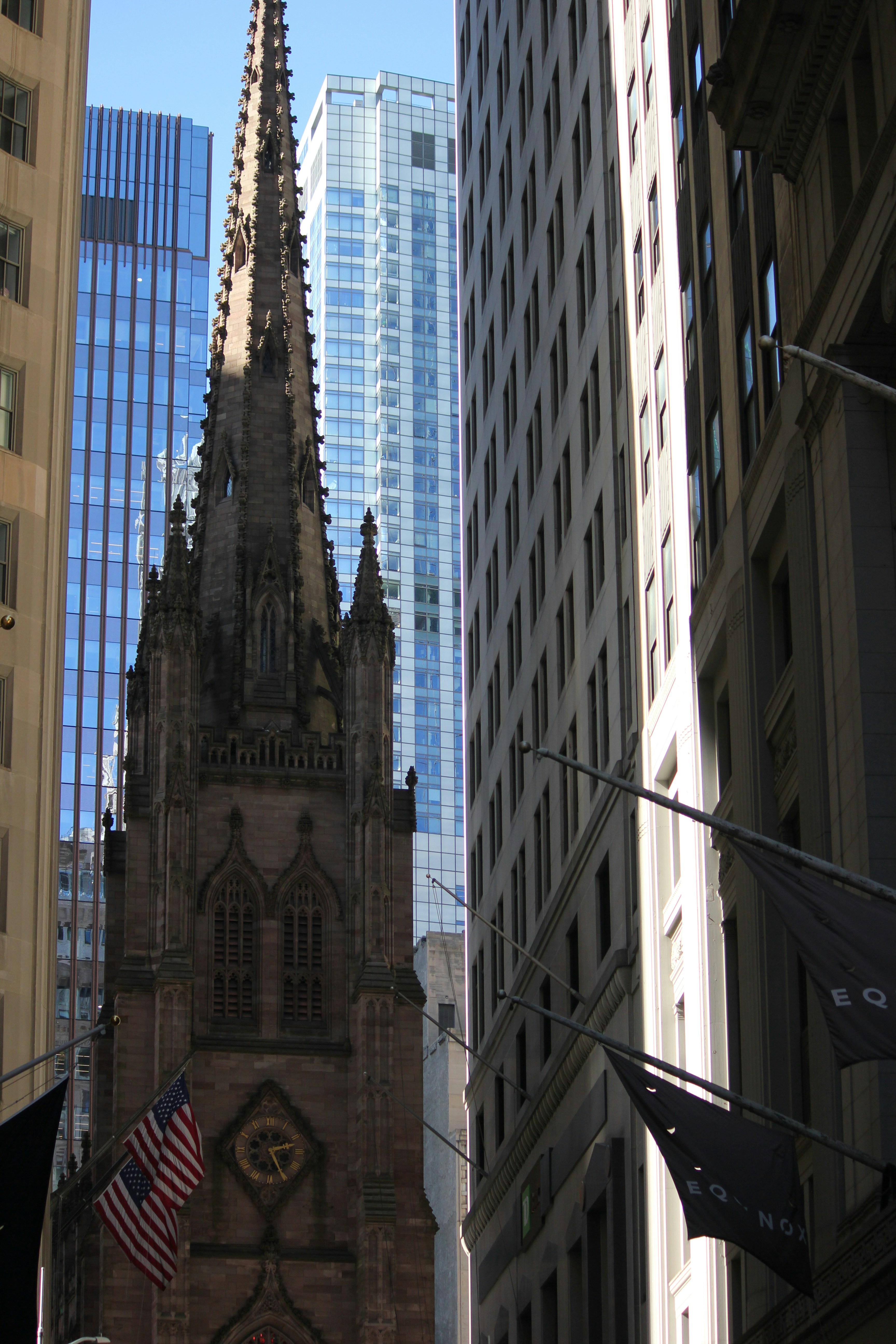 Spire Between Steel: A Gothic Needle in the City Canyon