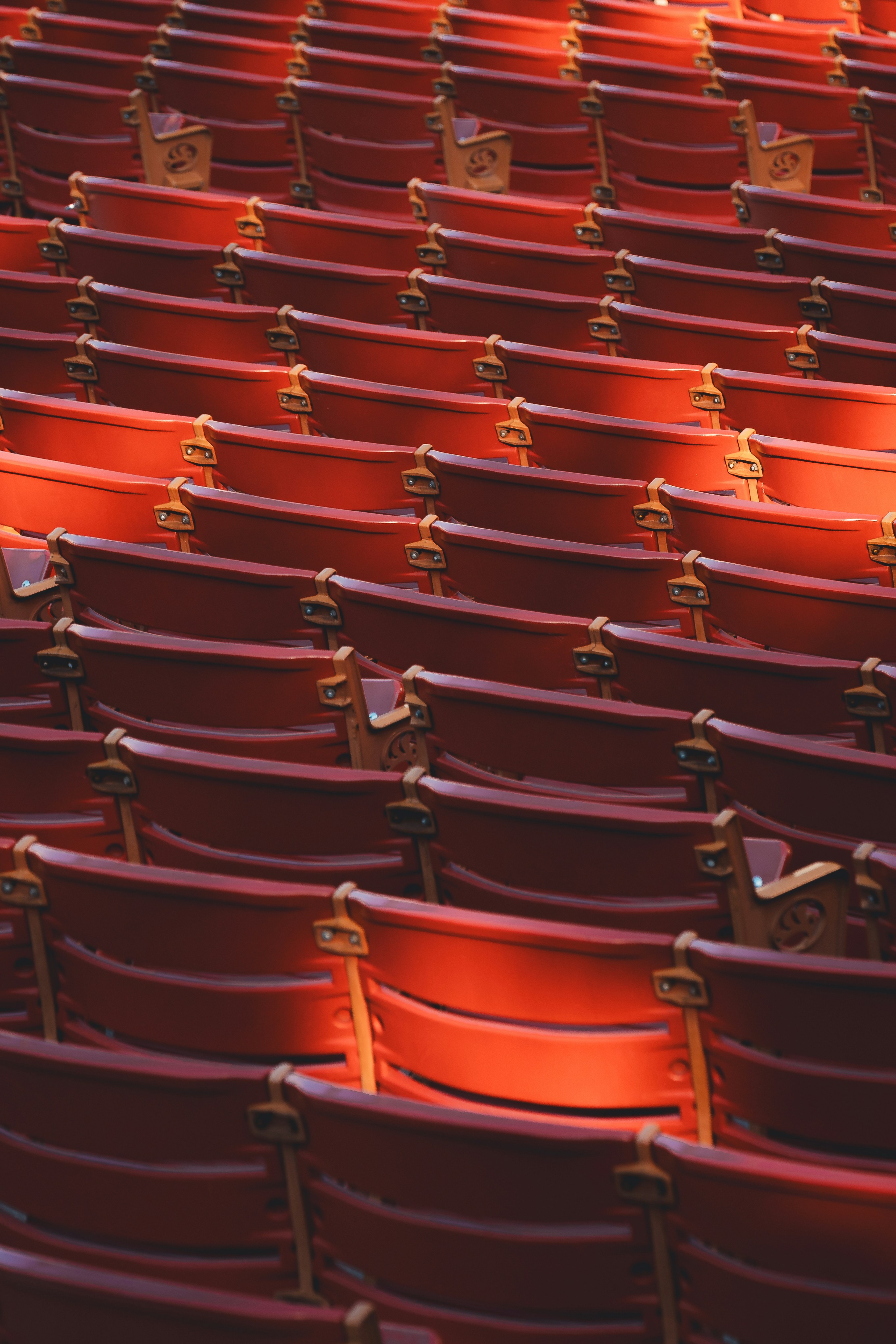 A row of red seats sitting next to each other photo – Free Jay pritzker ...