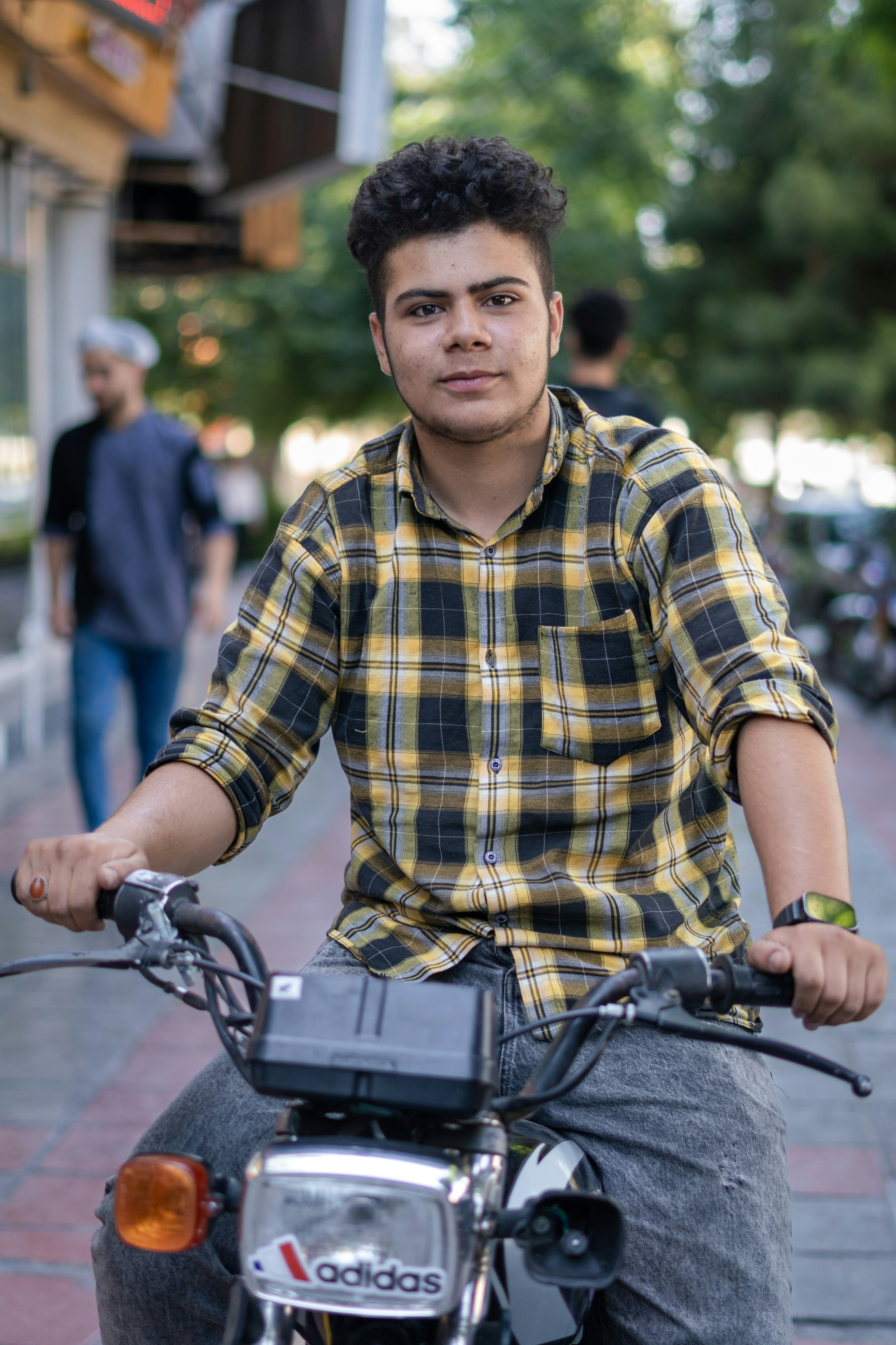 Youthful Rider: Focused Gaze Amid Urban Motion