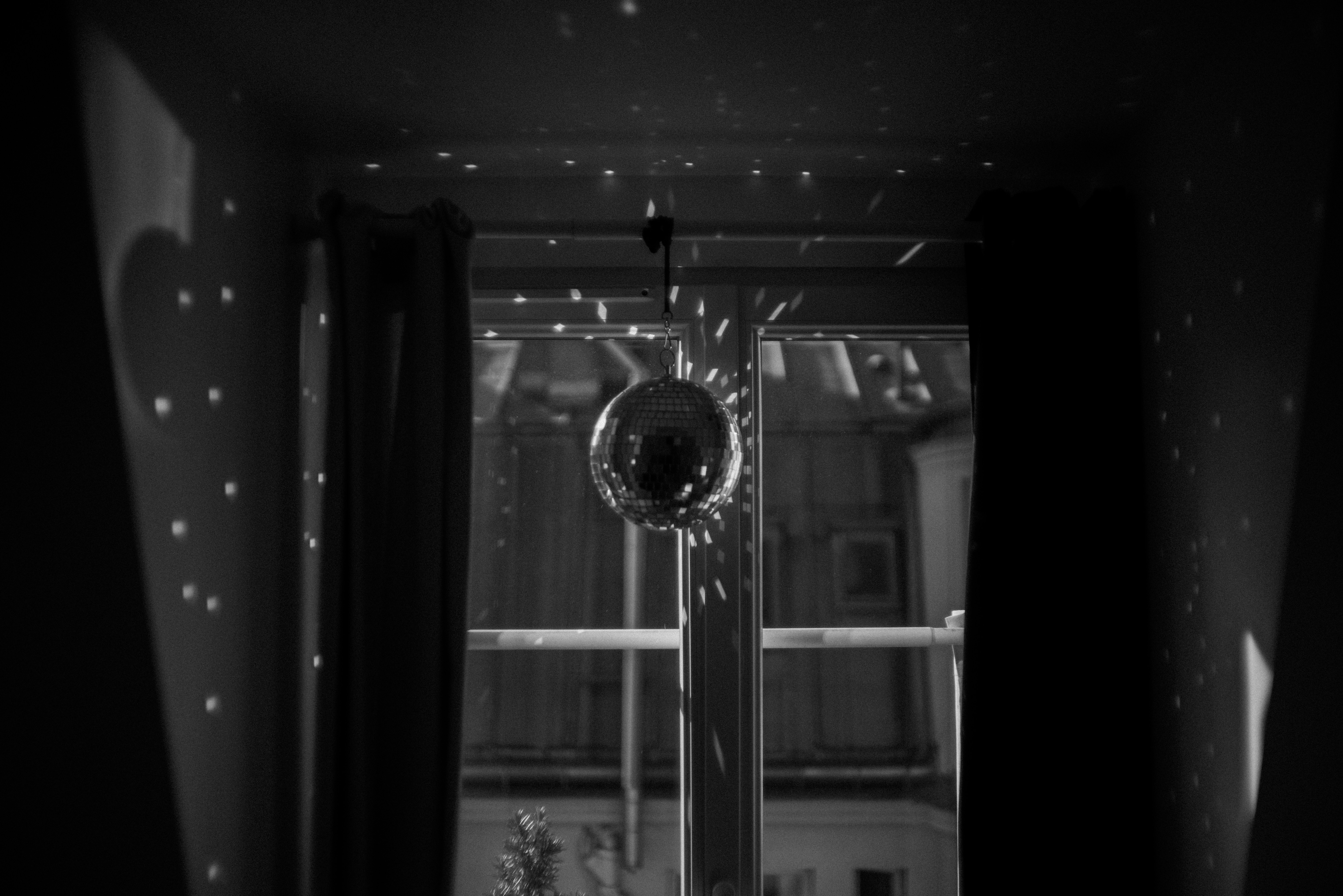 Monochrome Halo: a suspended ring of light in a shadowed workshop