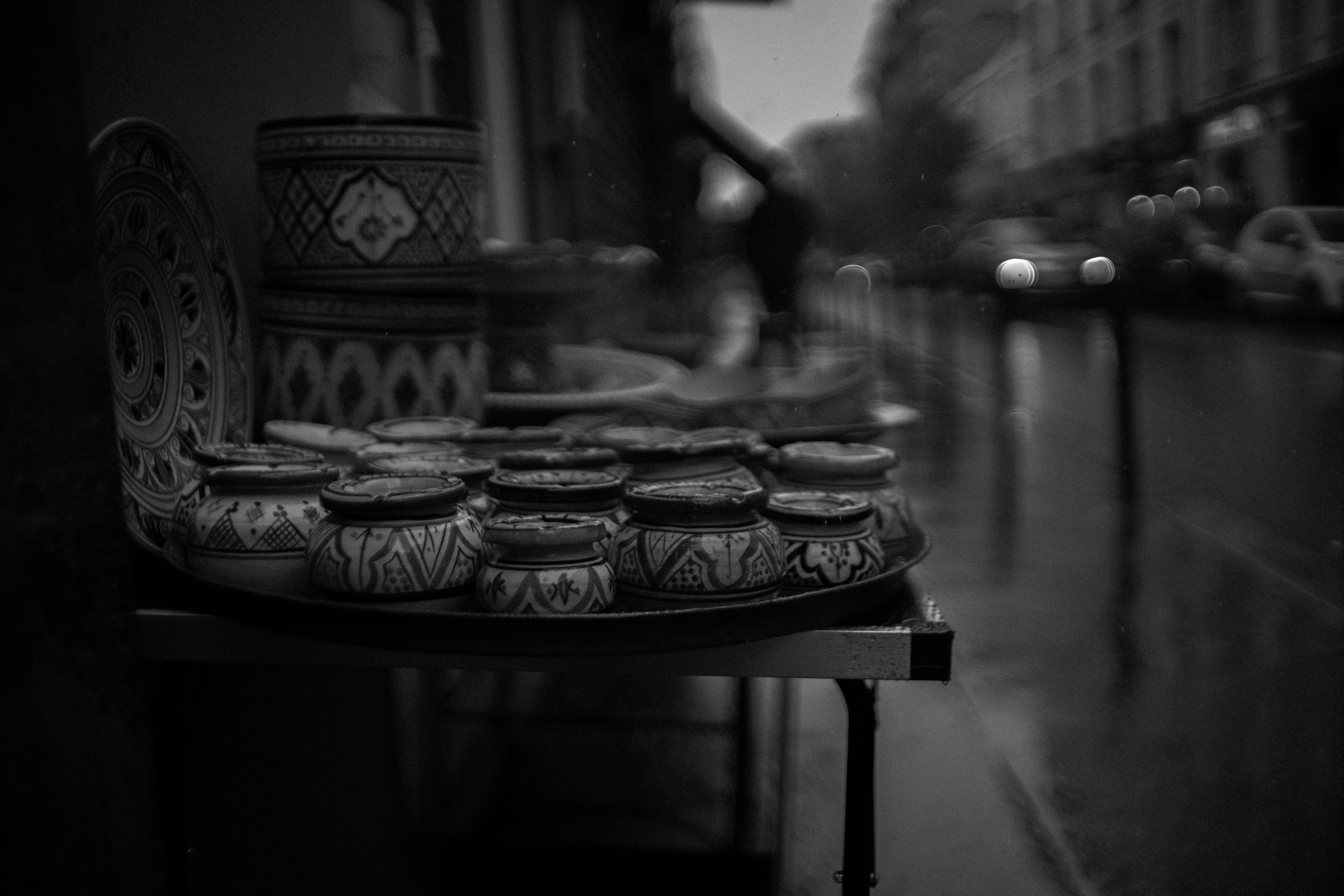 Vessels in a Rain-Washed Alley: A Monochrome Still Life