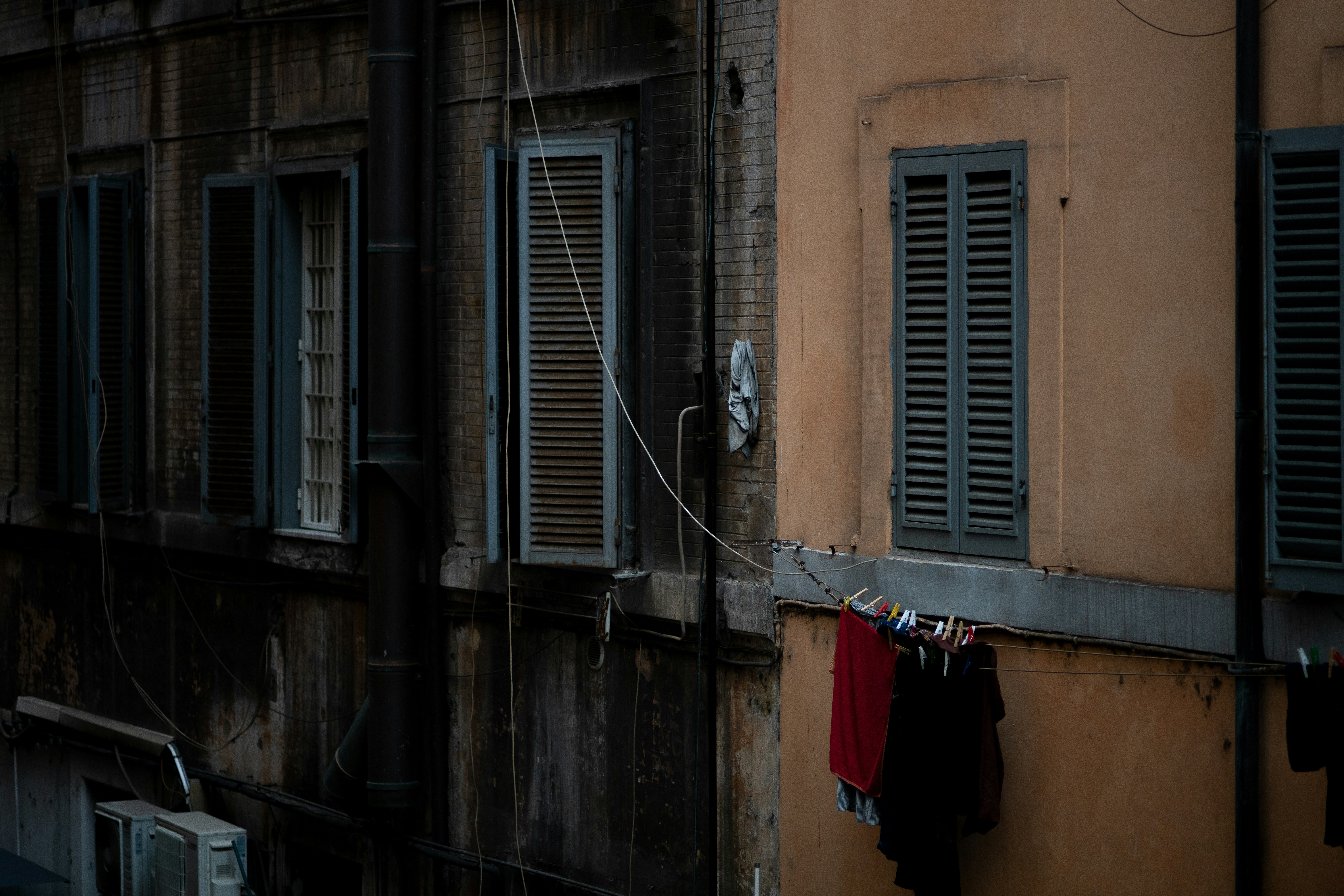 Threads of Color Along a Weathered City Facade