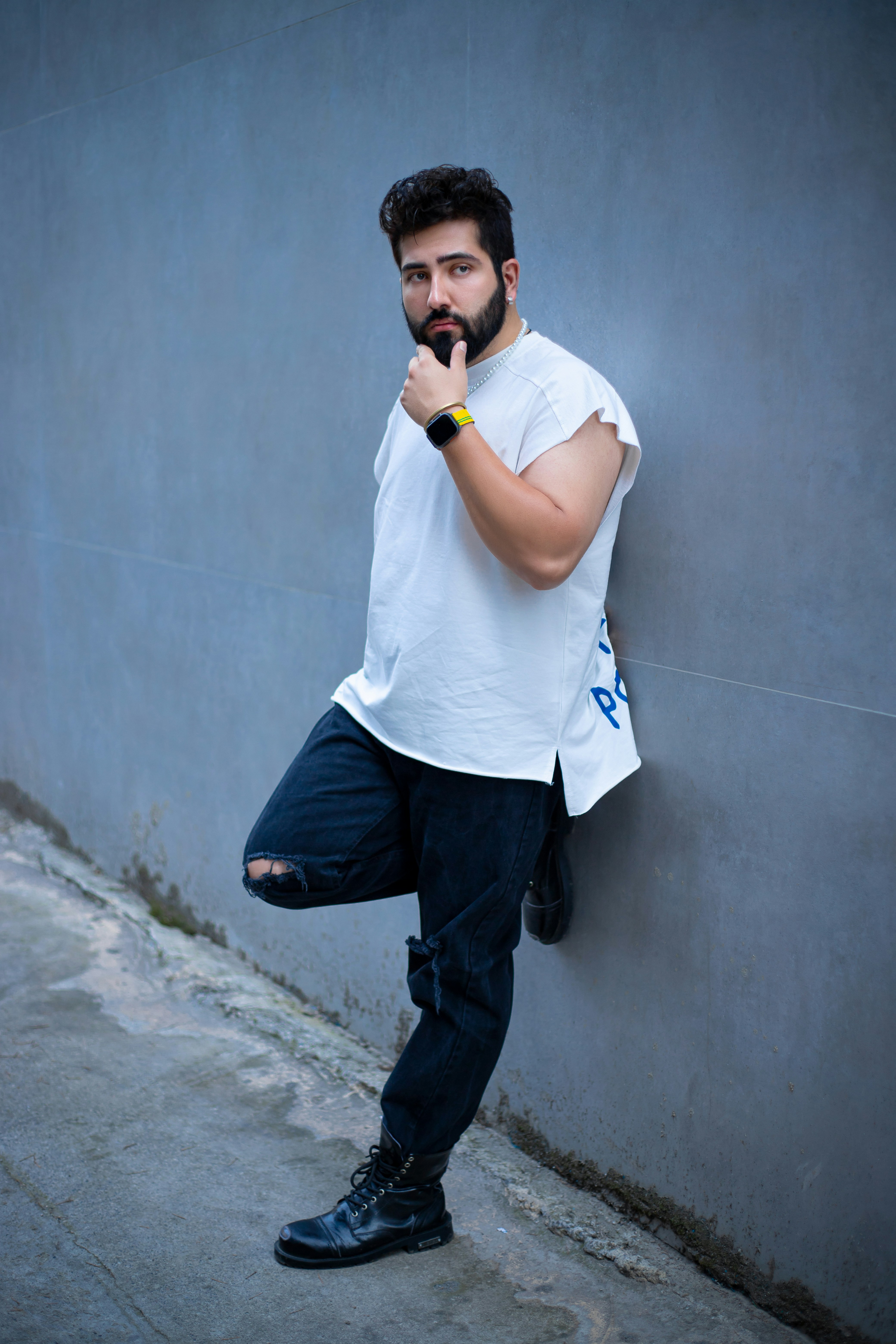 Chin-Up by the Blue Wall: A Casual Street Portrait