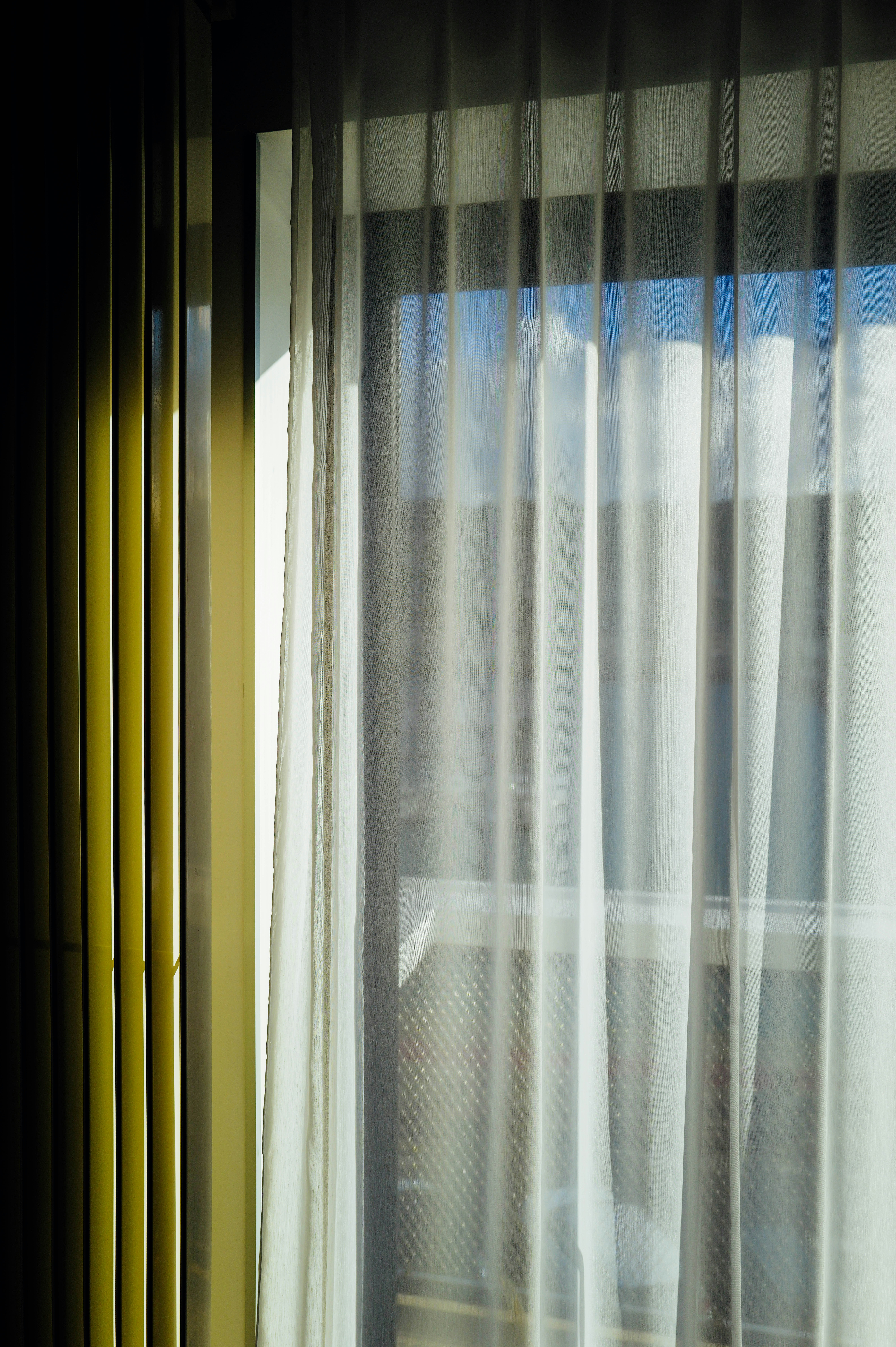 A window with a white curtain next to a window sill photo – Free ...