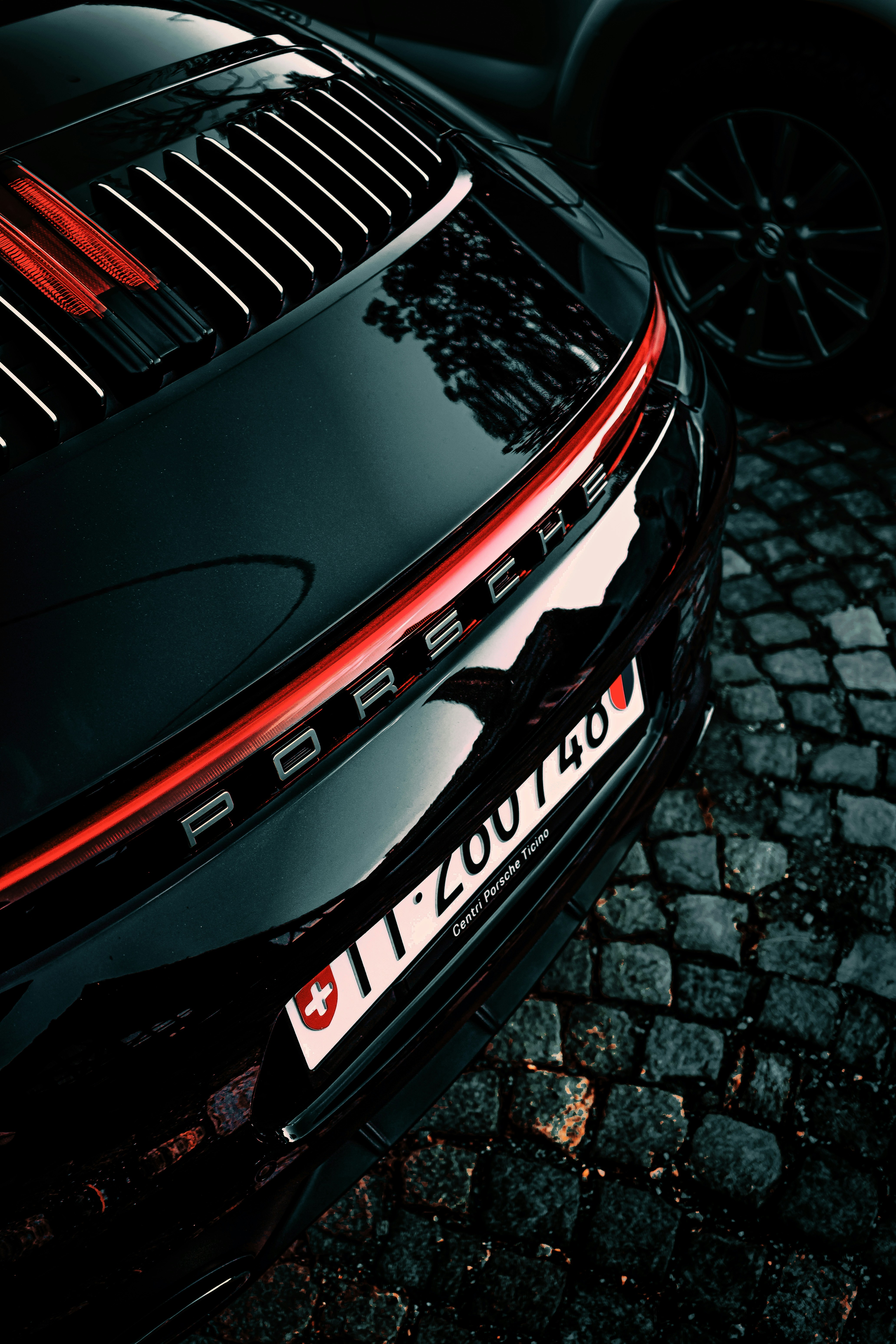 Hood Reflections on Cobblestones: A Porsche Moment