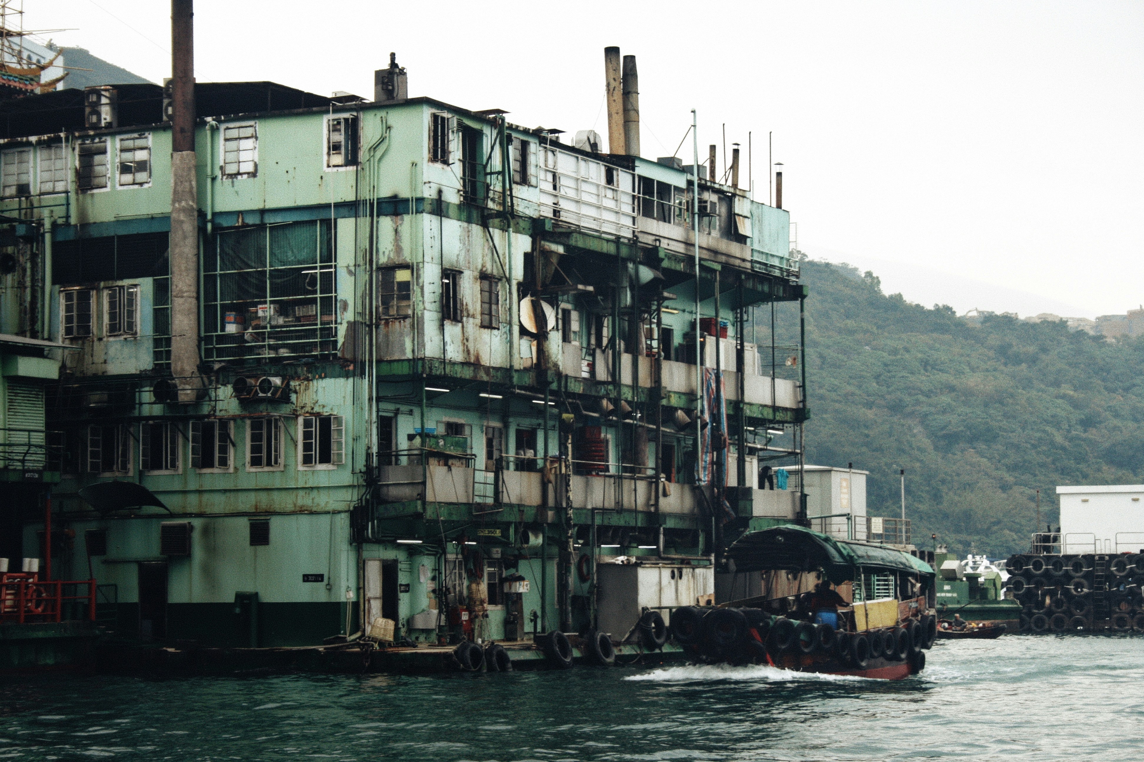Floating Heritage: The Weathered Factory Steadily Tugs at the Waterfront