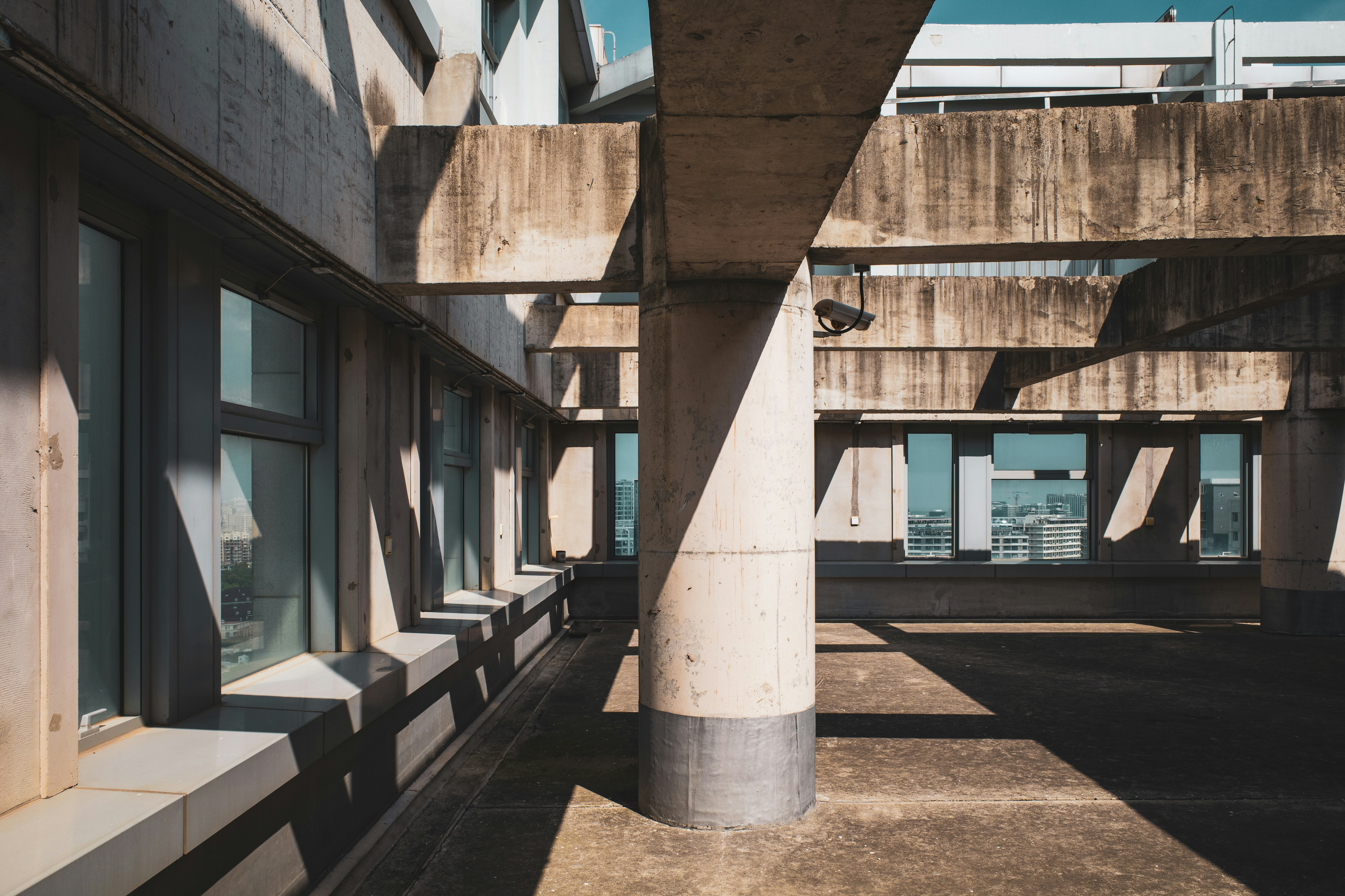 A building with a bunch of windows next to it photo – Free Pudong Image ...