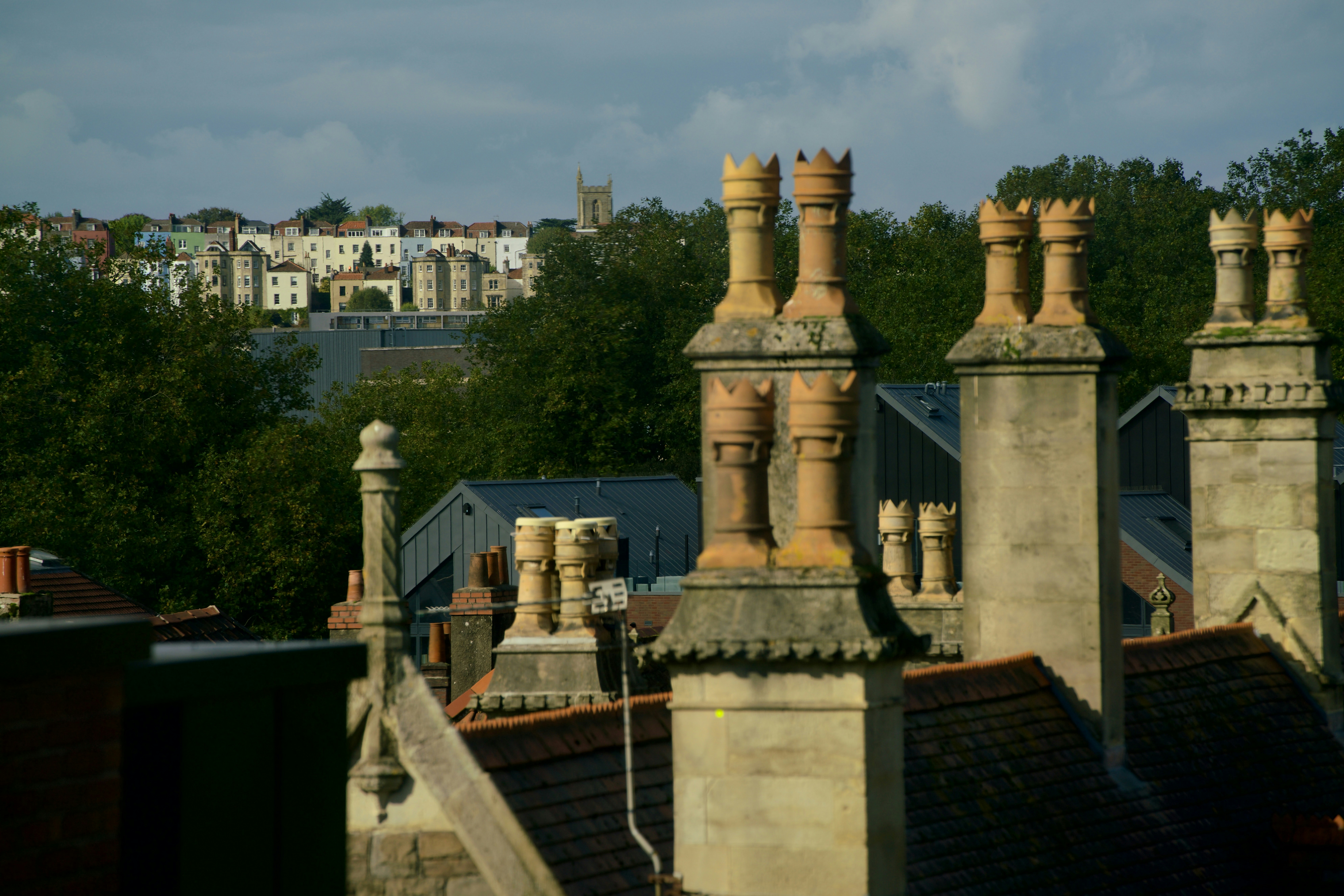 Chimney Spires Over a Distant Cityscape