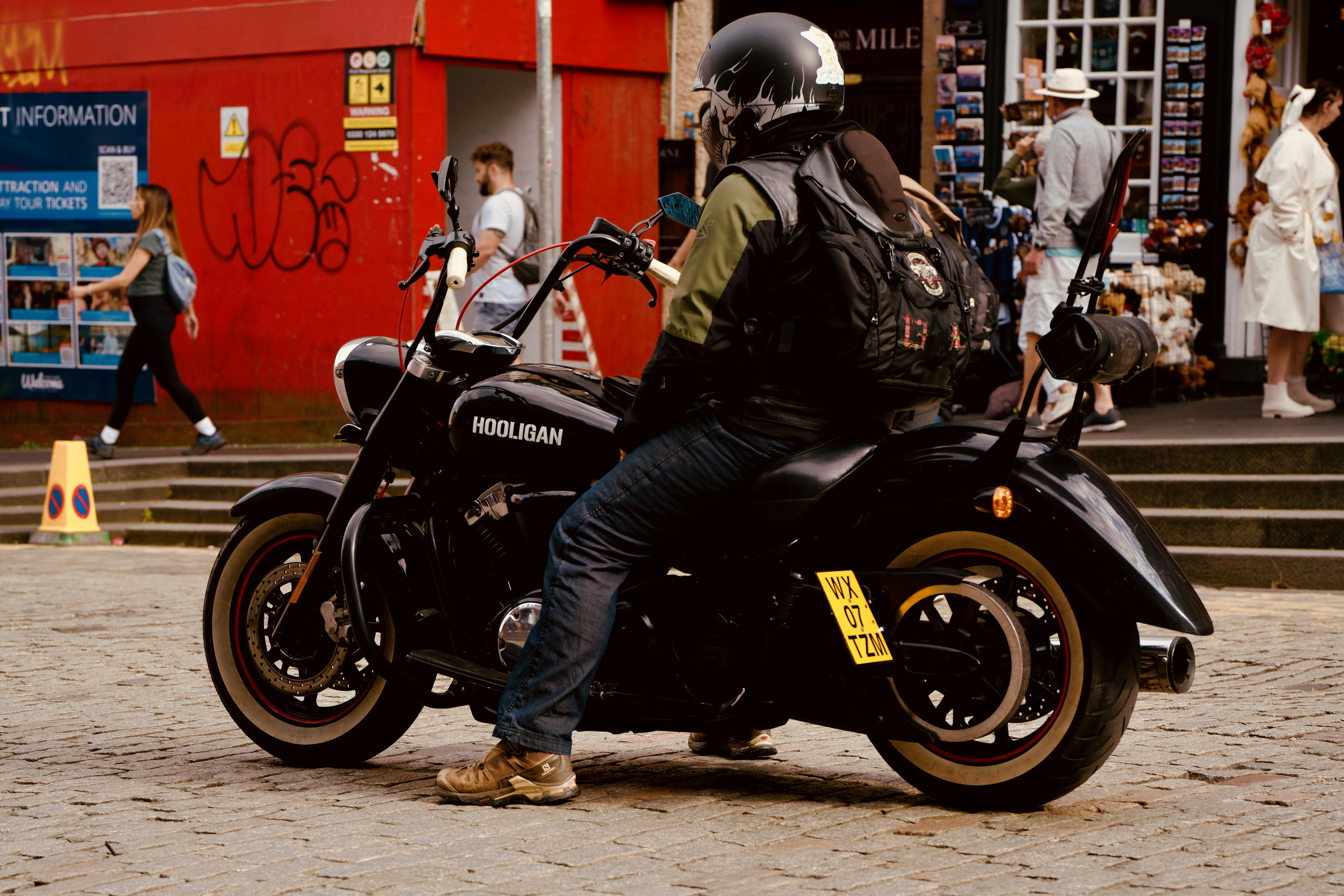 Hooligan on Cobblestones: A Dark Cruiser Pauses Between City Strolls