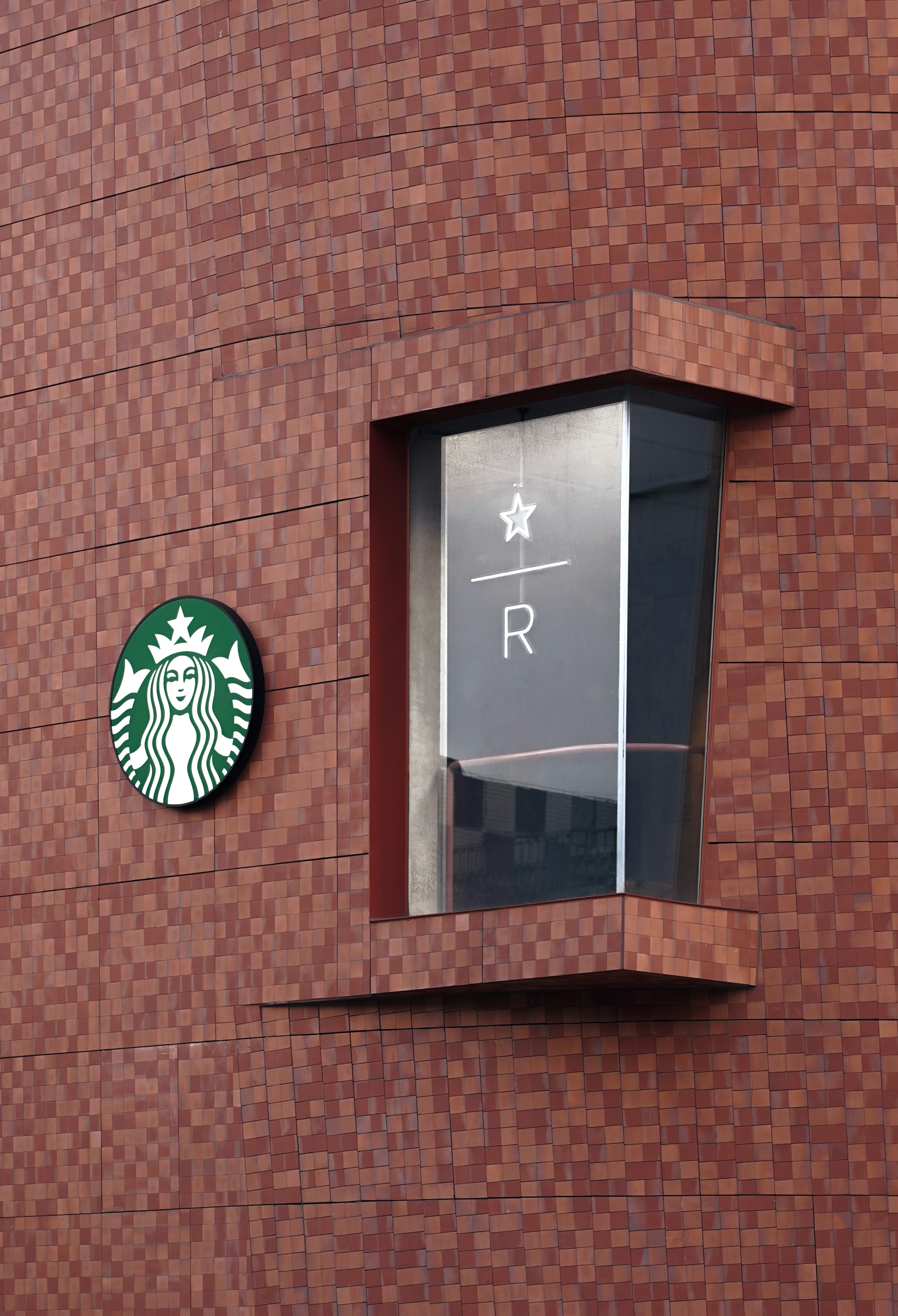 A red brick building with a starbucks logo on it photo – Free Luohu ...