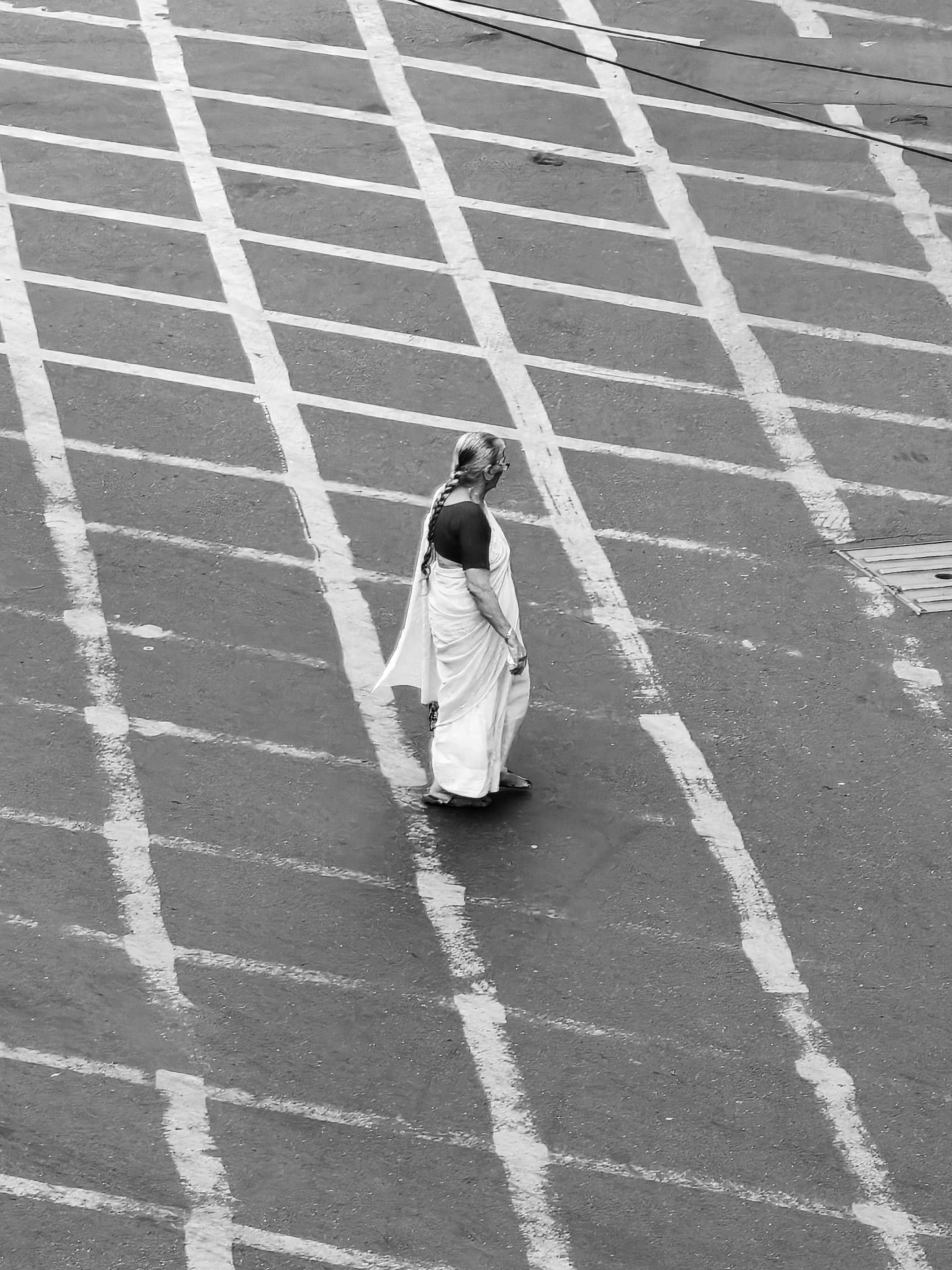Solitary figure on a tiled grid of streets