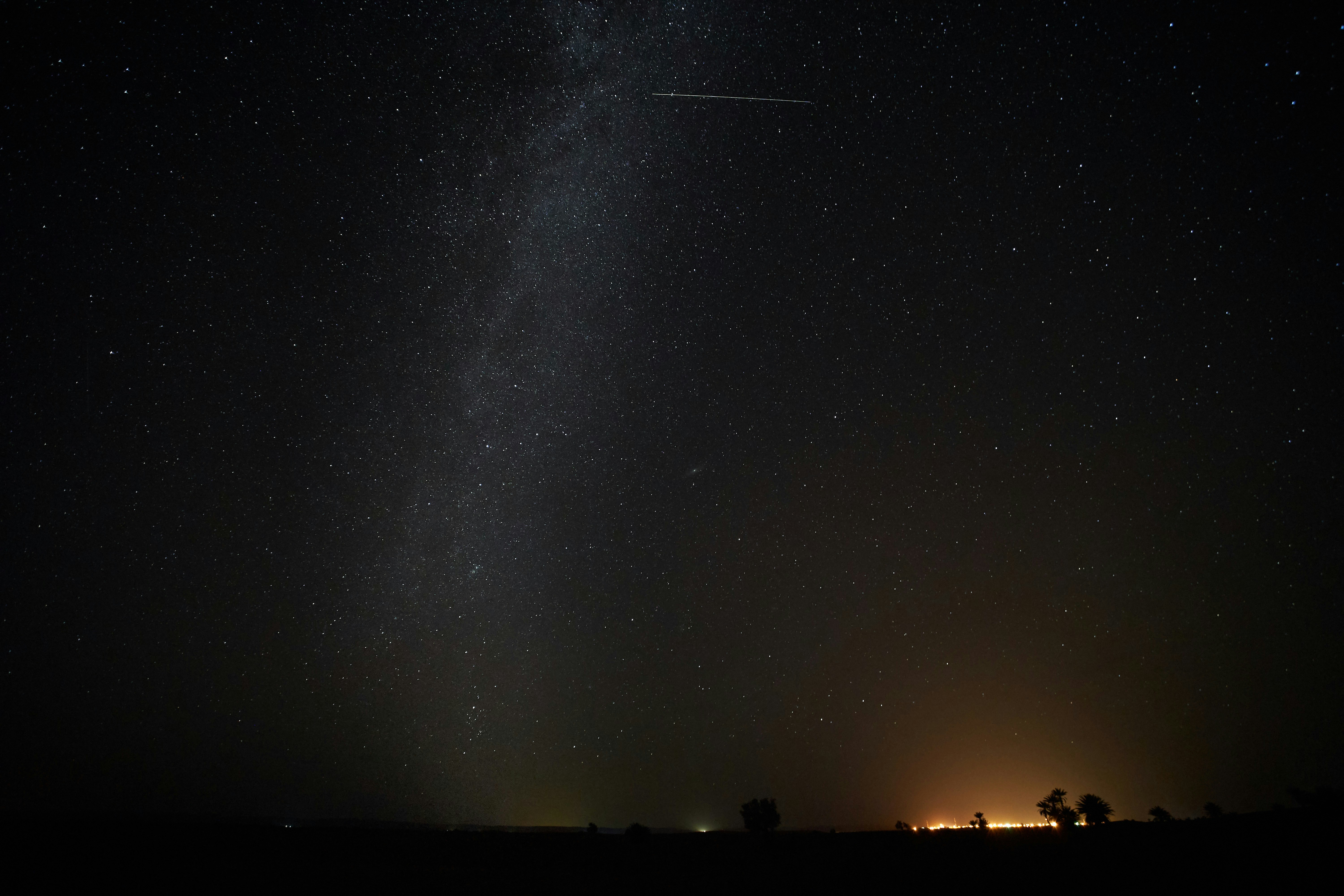 A night sky with stars and a shooting star photo – Free Space Image on ...