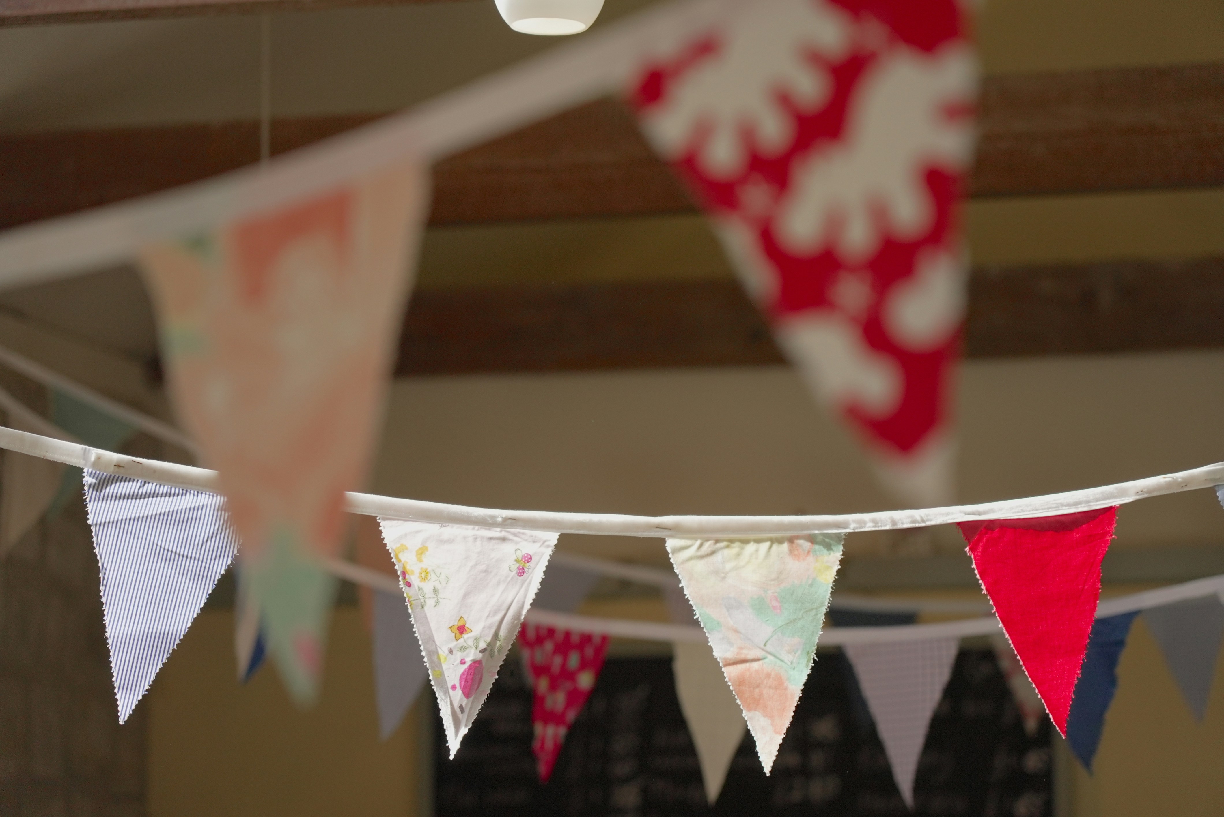 A group of flags hanging from a ceiling photo – Free Flags Image on ...