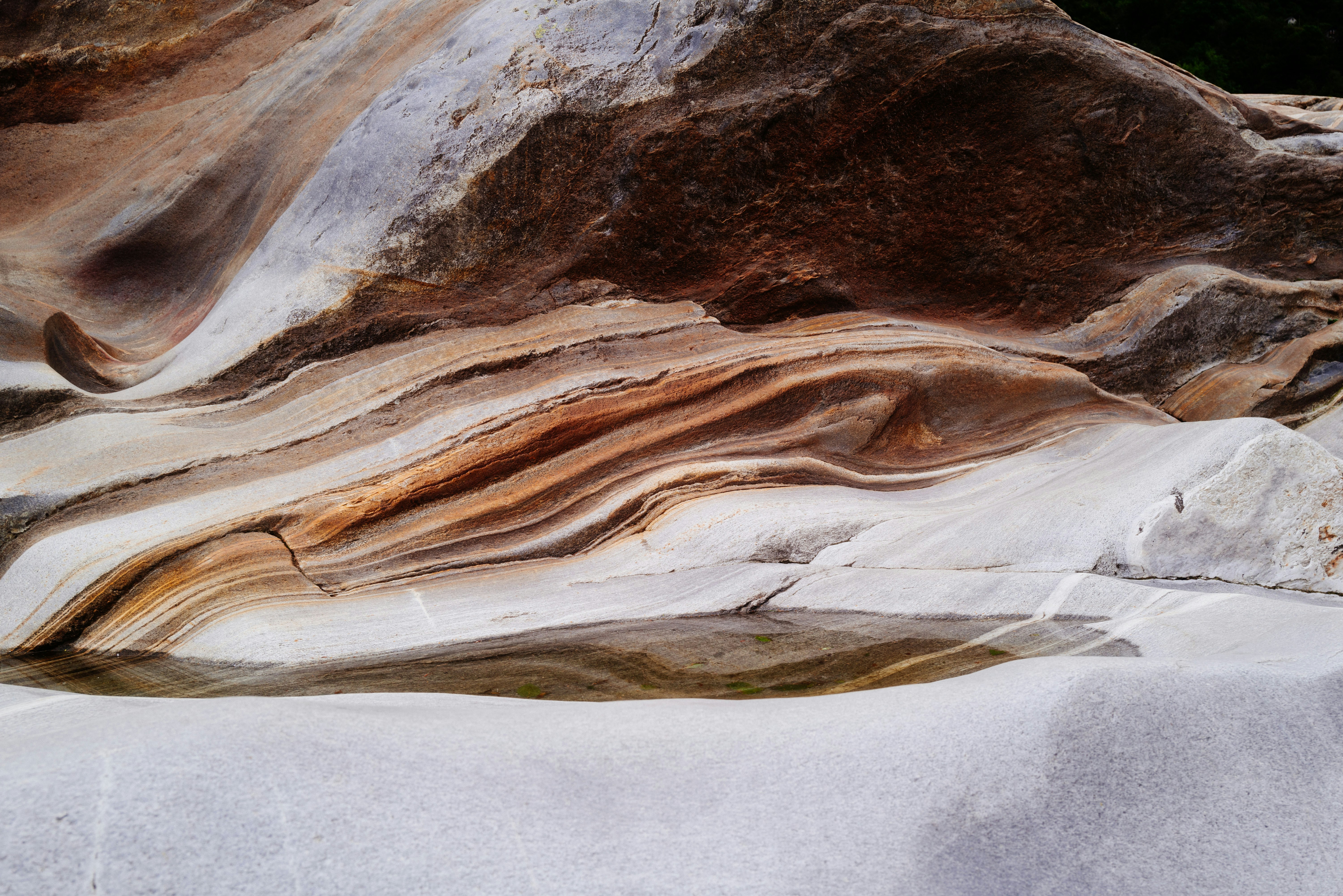 Intricate patterns of layered rock formations showcasing natural erosion and geological history.