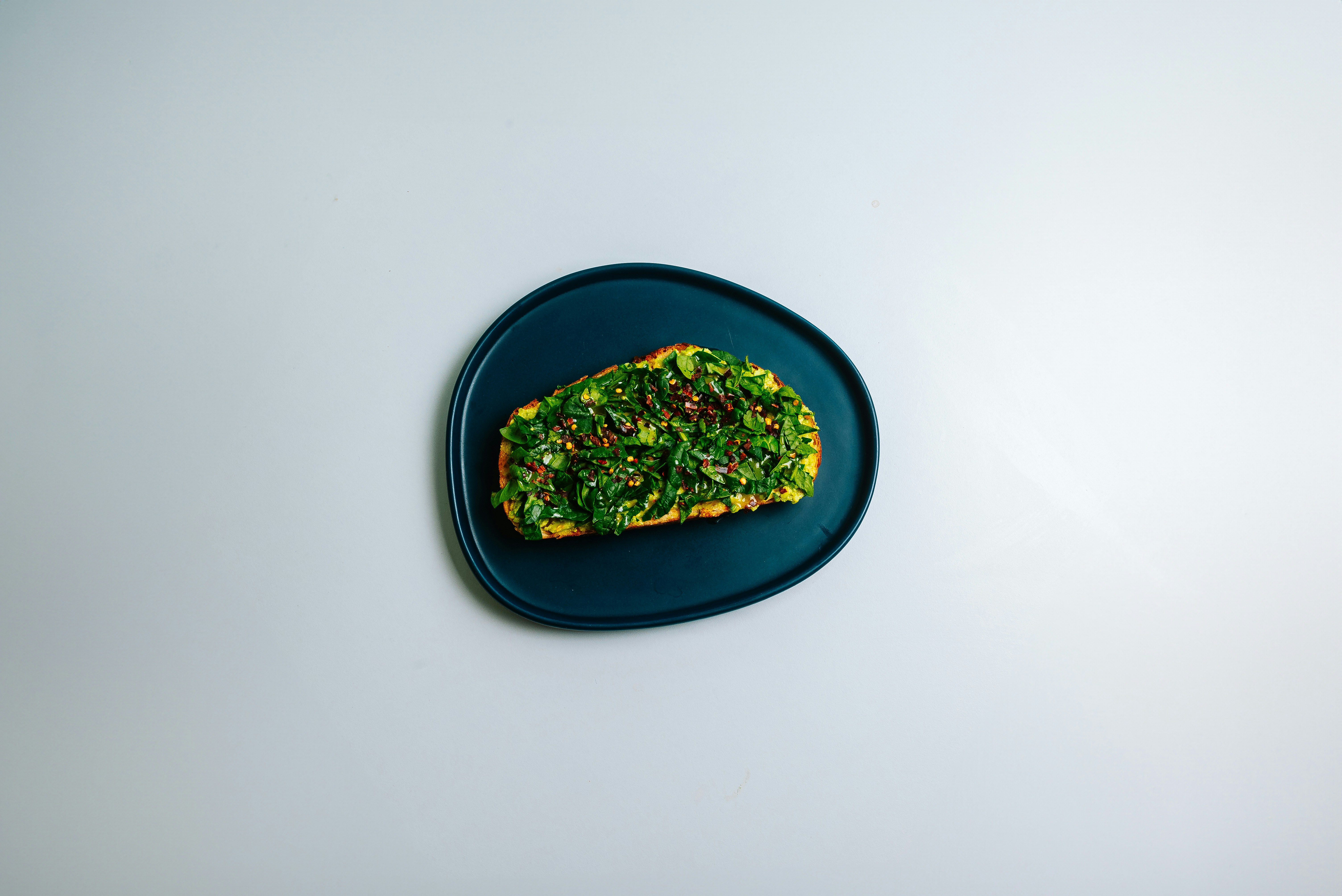 A blue plate with a piece of food on it photo – Free Coffee Image on ...