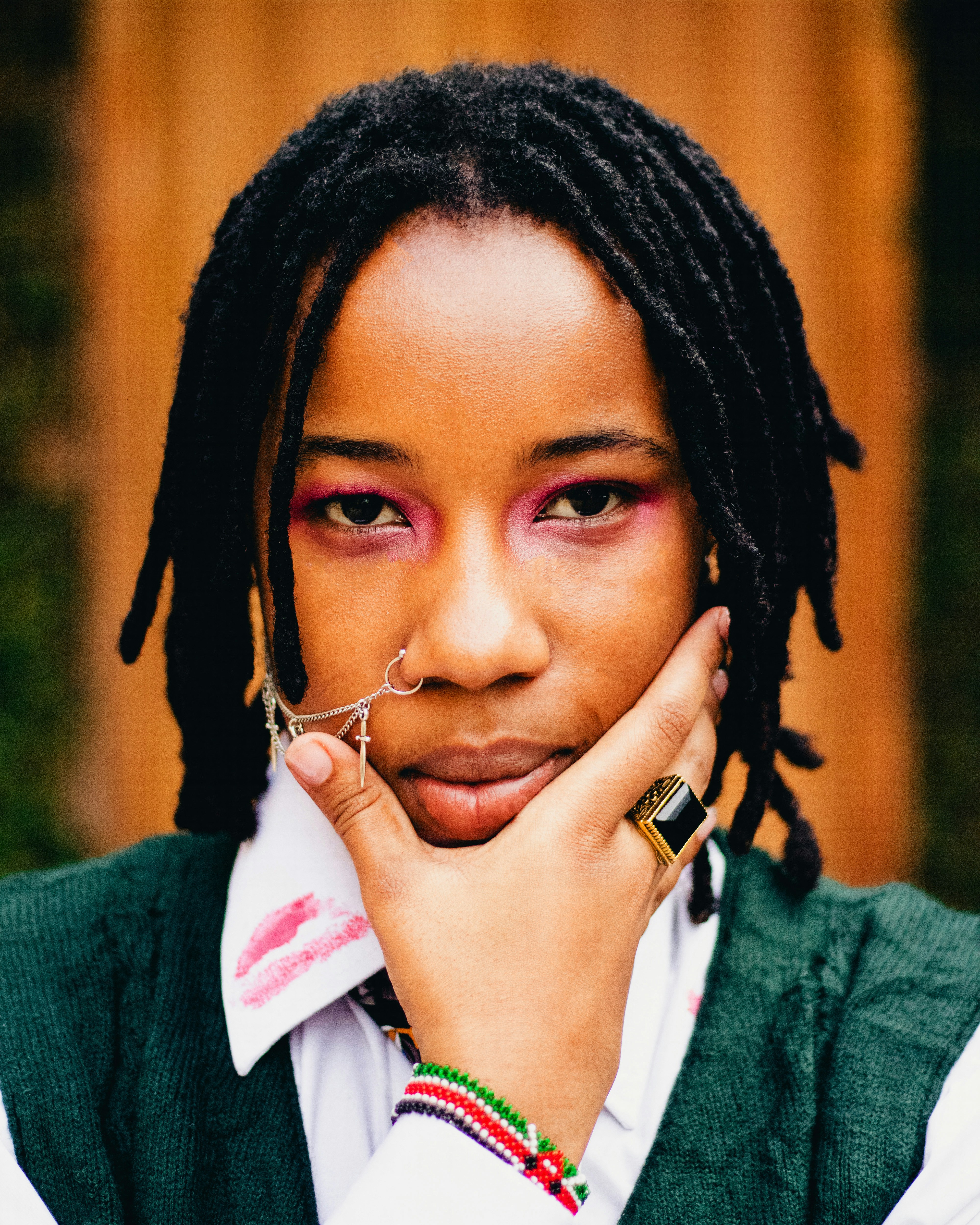 A woman with dreadlocks wearing a green vest photo – Free Kenya Image ...