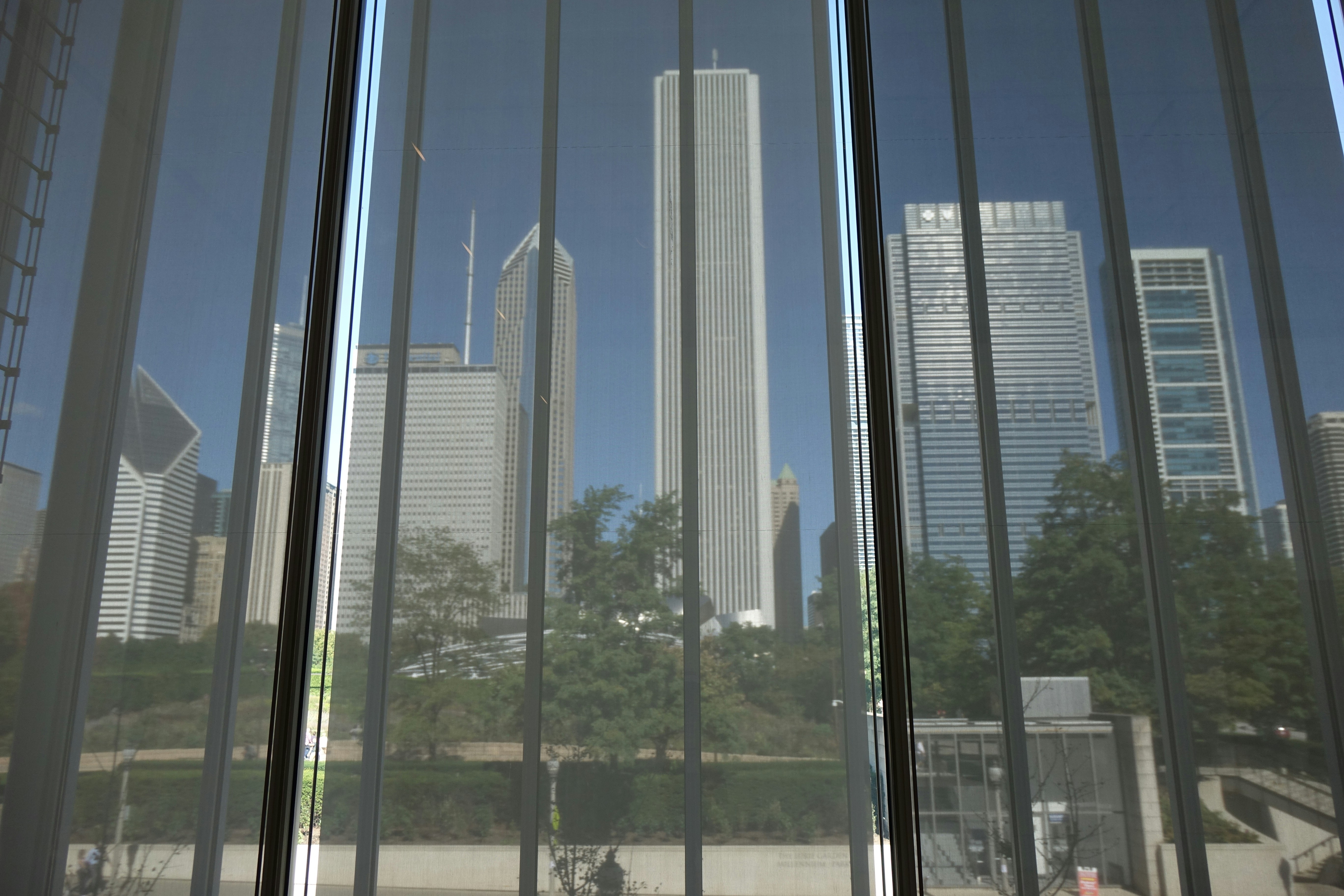A view of a city through a glass window photo – Free Chicago Image on ...