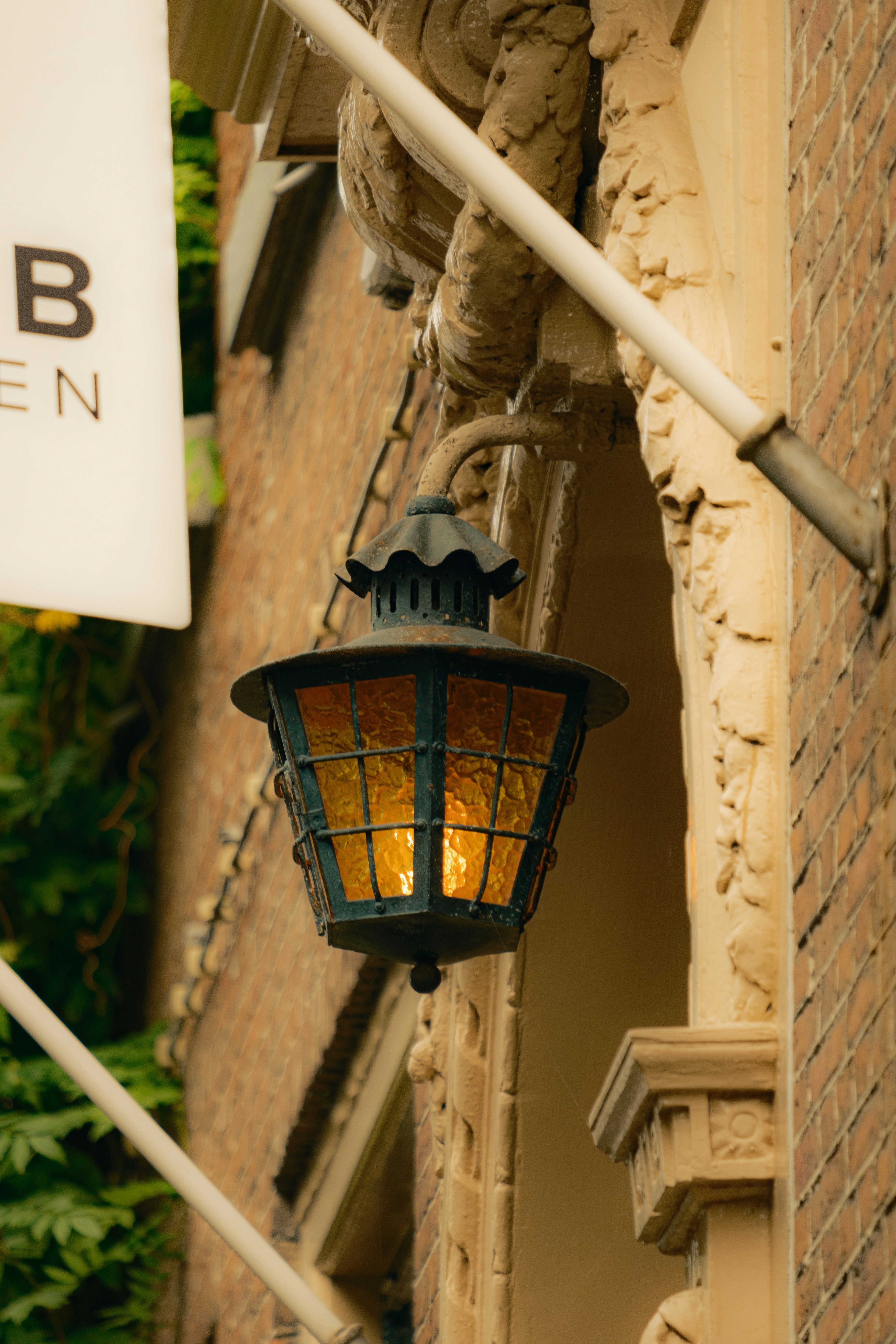 Amber Glow Lantern on a Brick Archway