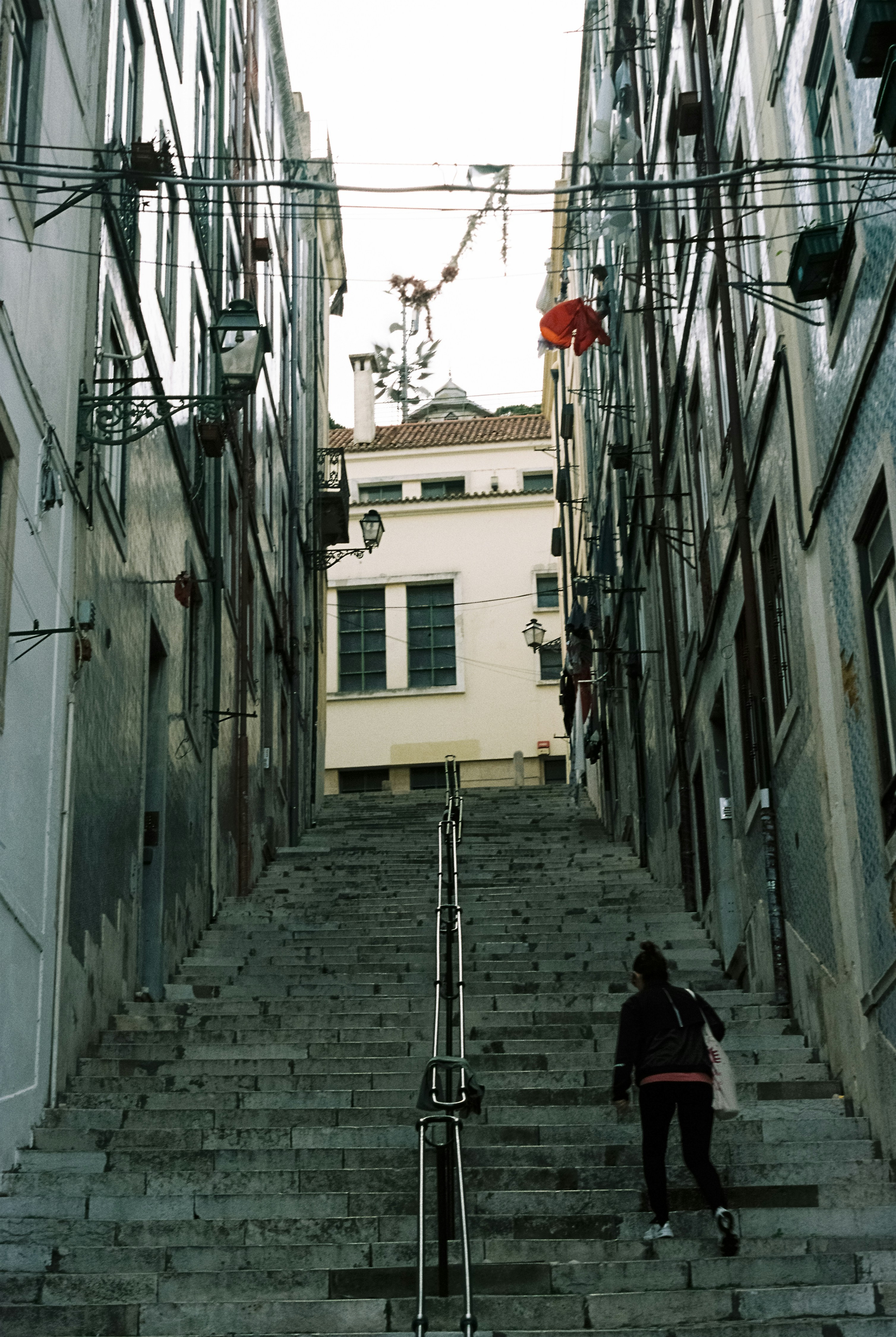 Staircase Through the Narrow City Corridor