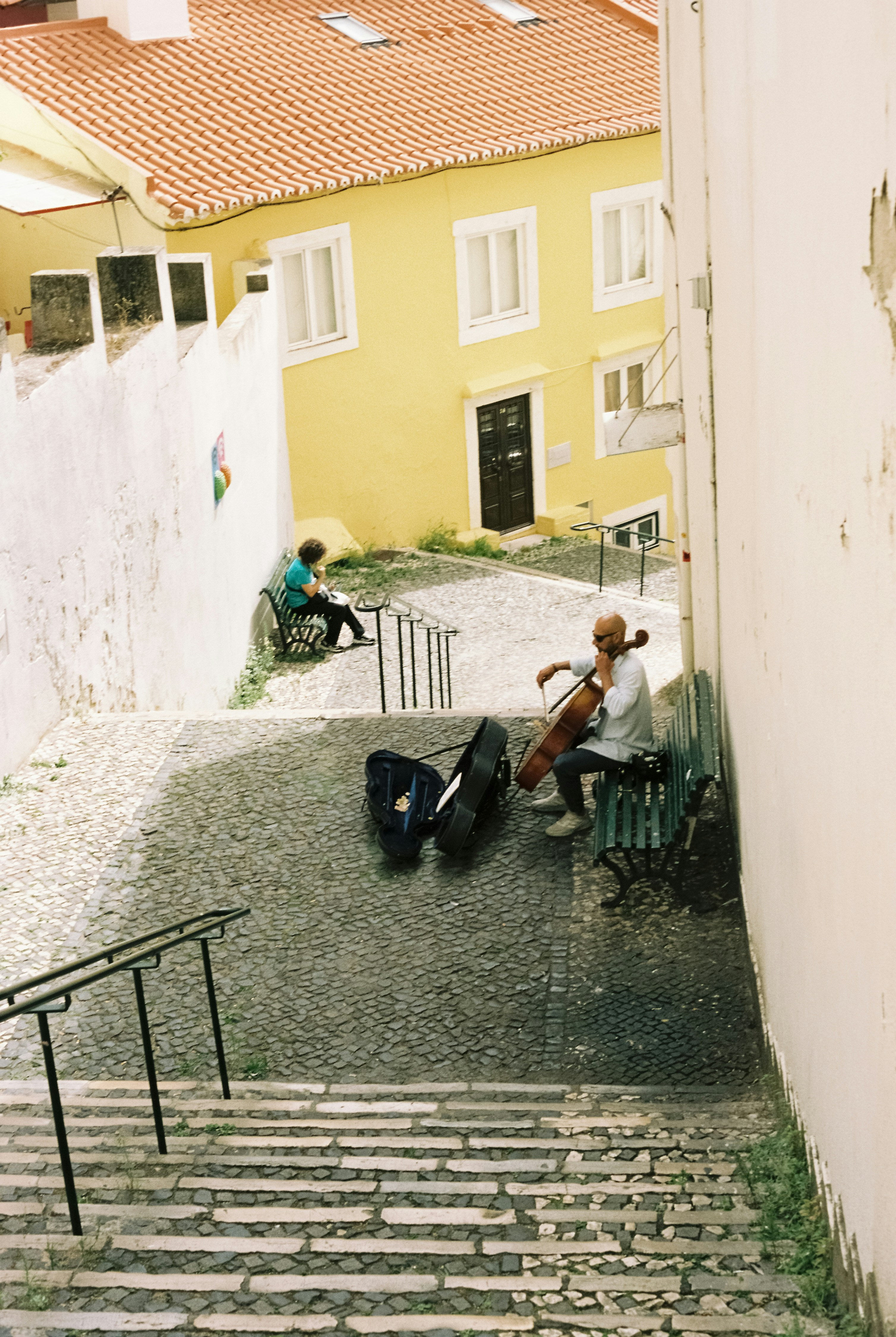 Cellist on the Lantern-Striped Steps