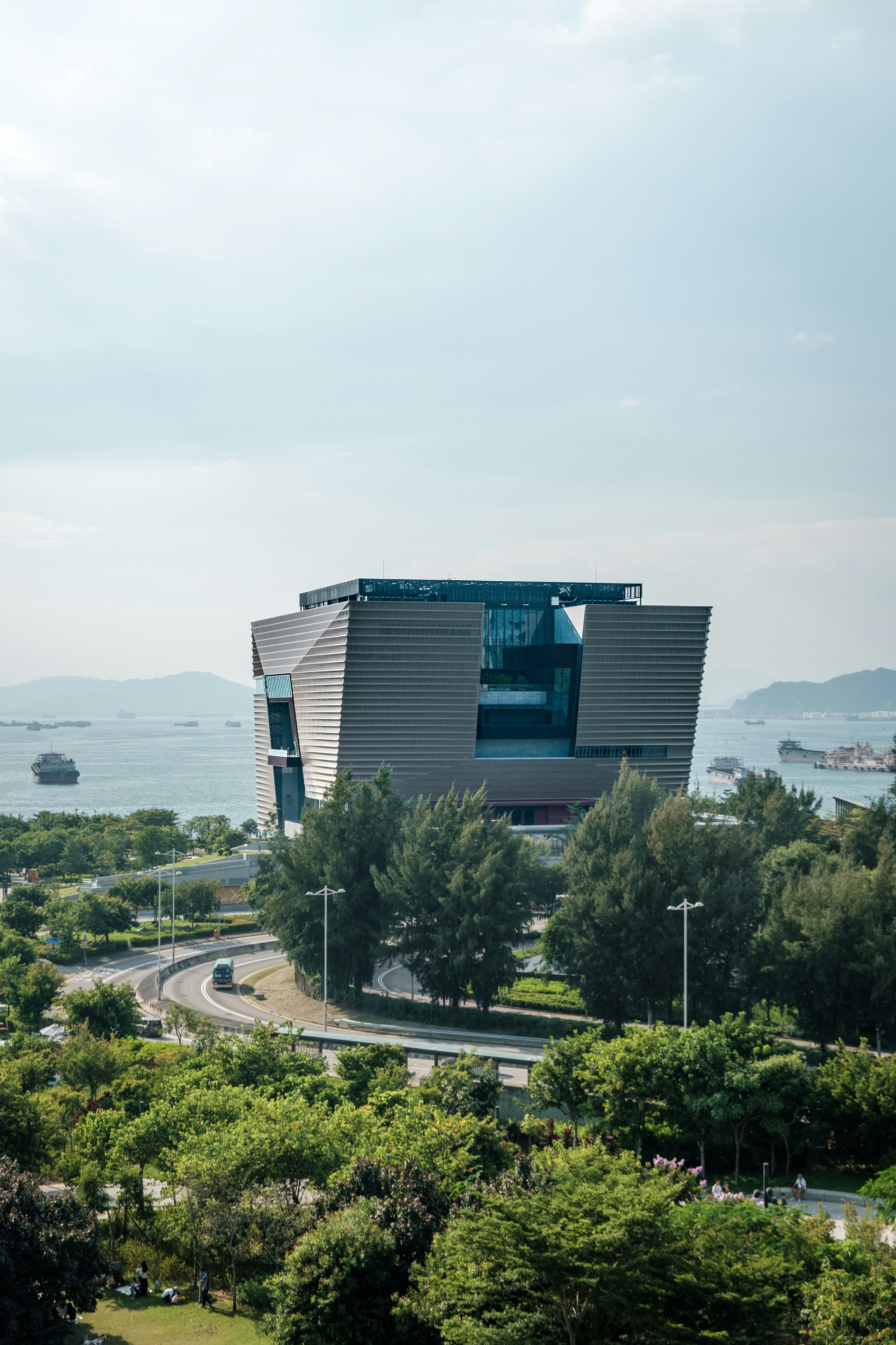 Harbor Facade: An Angular Modernist Jewel Rising from a Green Fringe