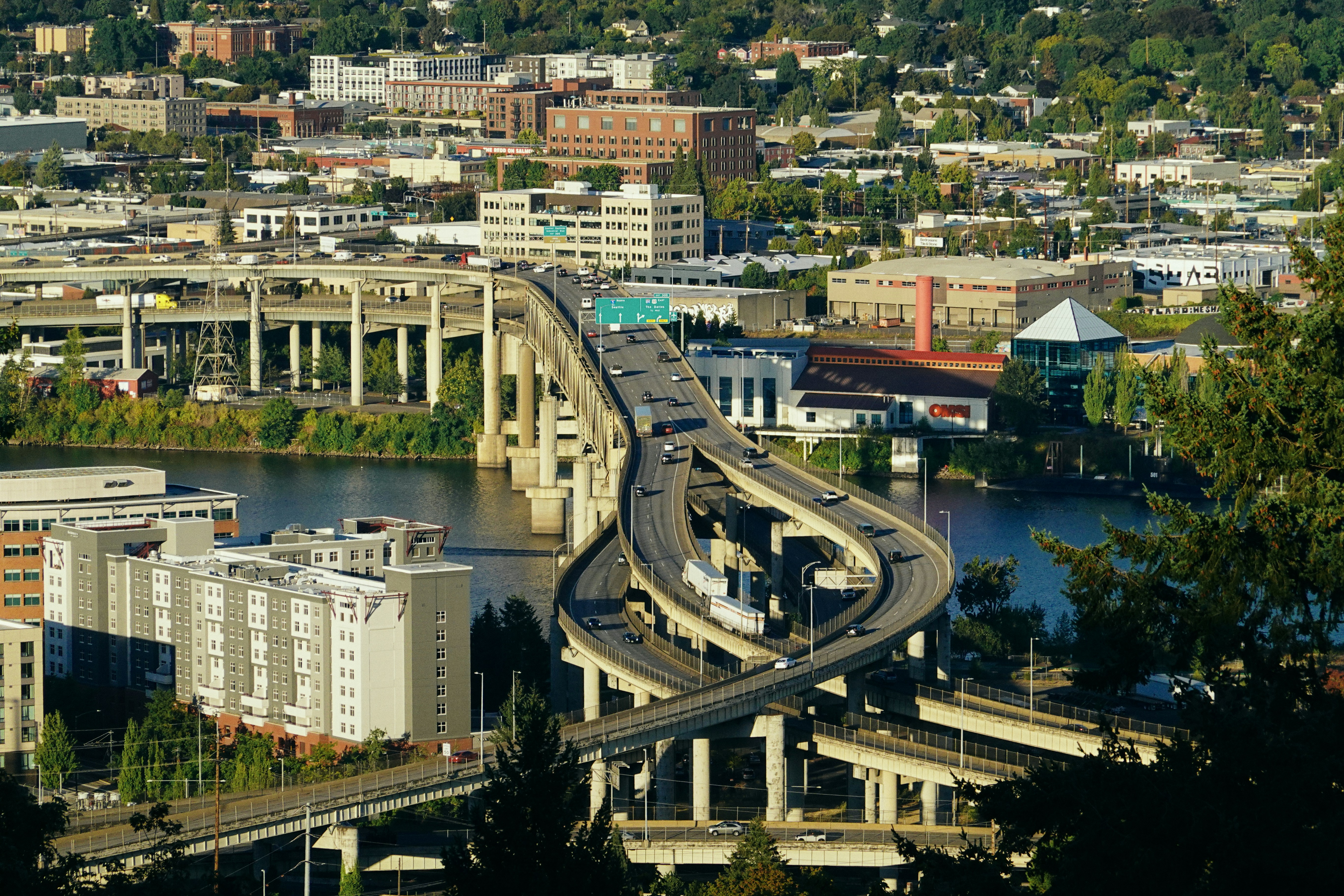 A view of a city and a bridge over a river photo – Free City Image on ...