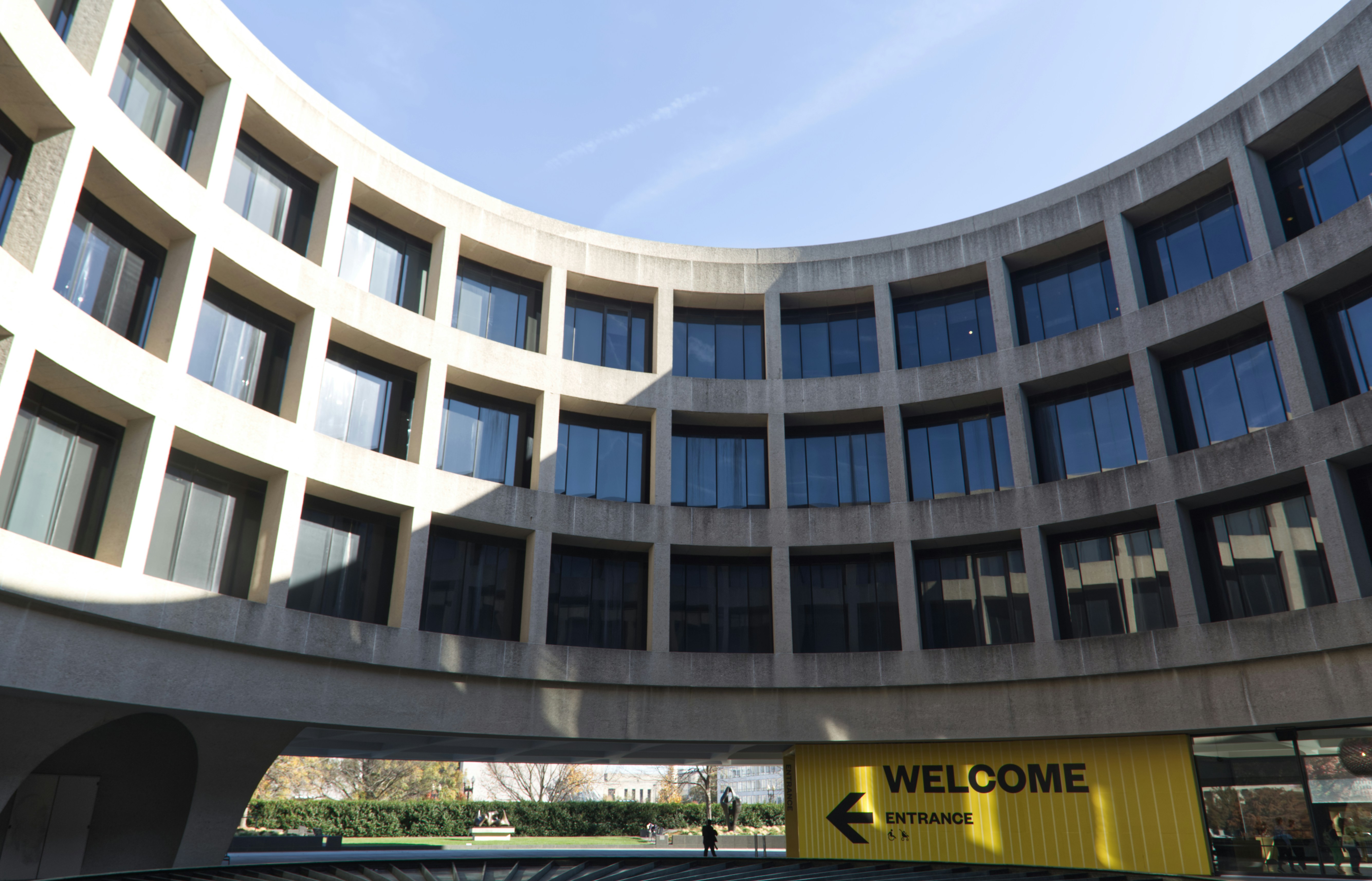 Curved Concrete Atrium: Windows, Arches, and a Bold Welcome