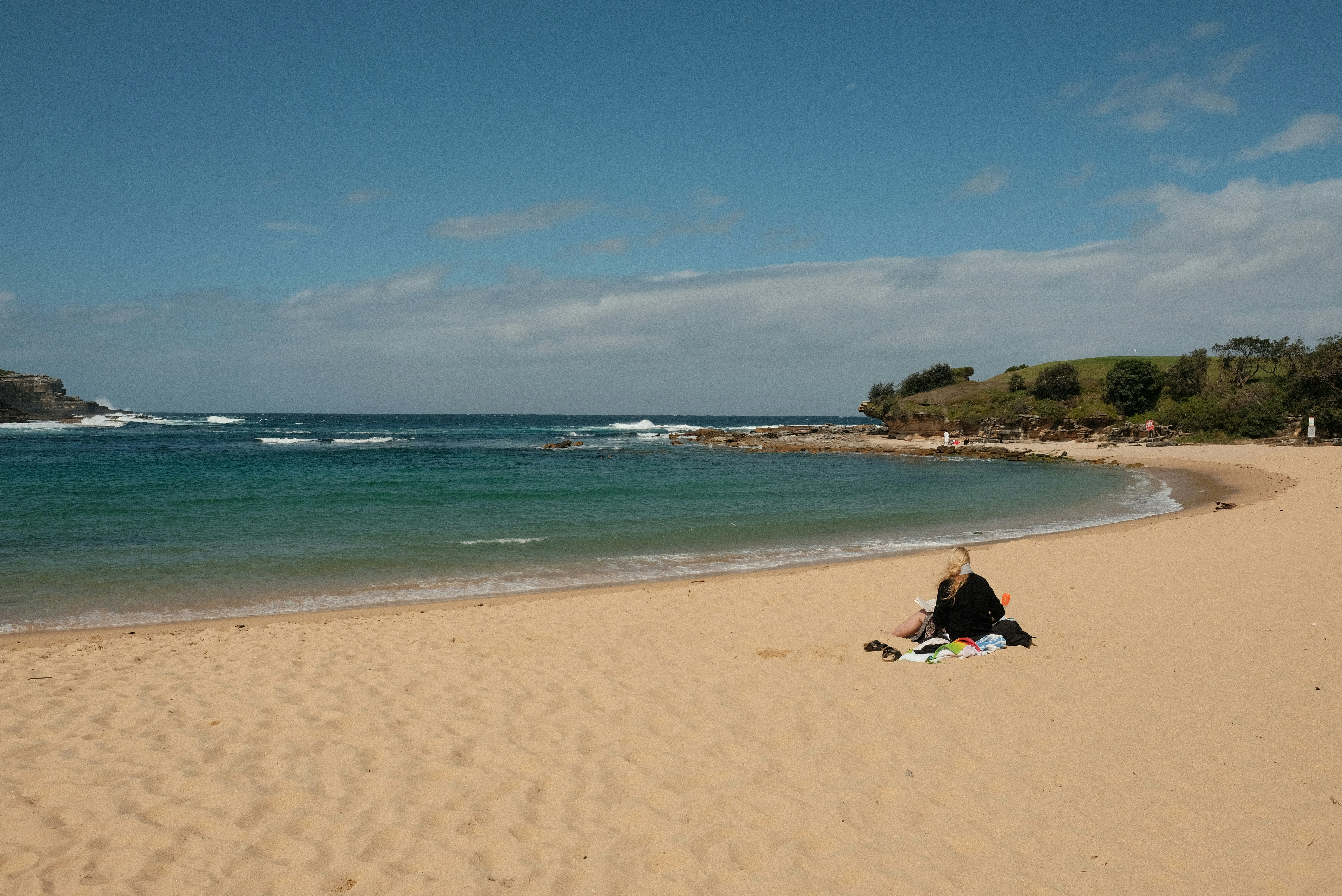 Solitary Moment on a Curved Beach