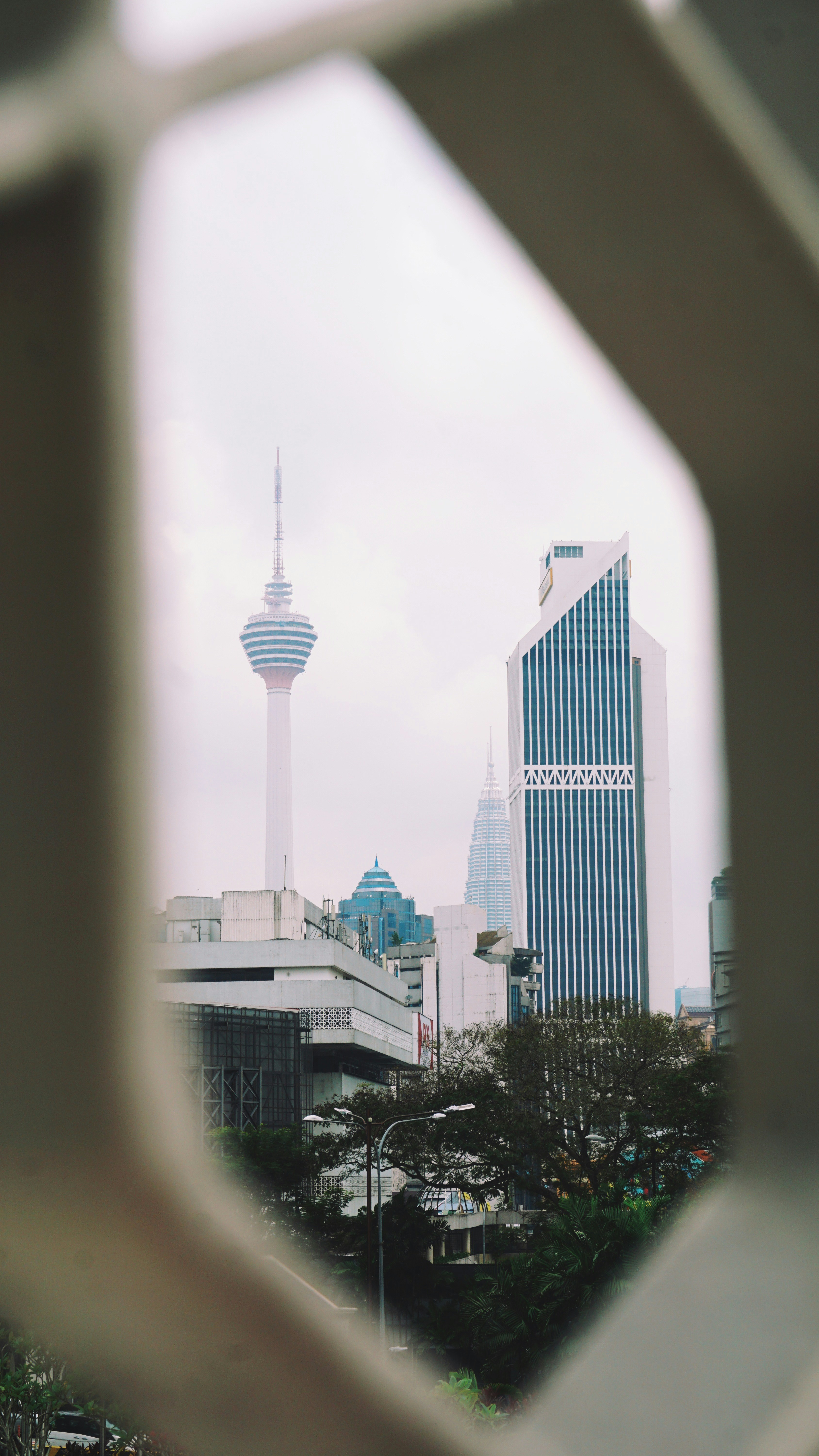 Framed Skyline: Shanghai’s Towers Peeking Through a Concrete Iris