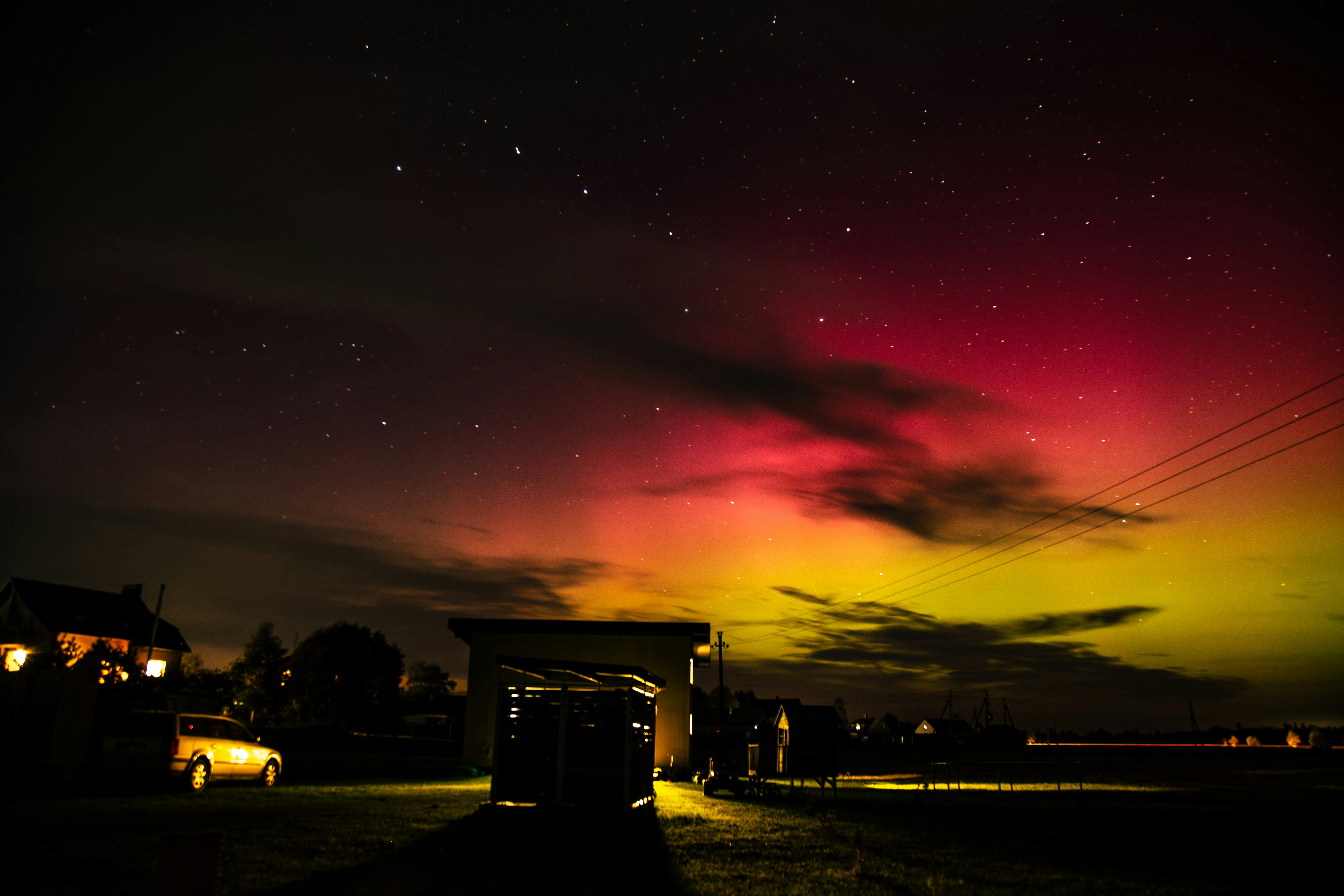 Aurora over Quiet Suburb: Neon Sky Beneath a Silent Driveway