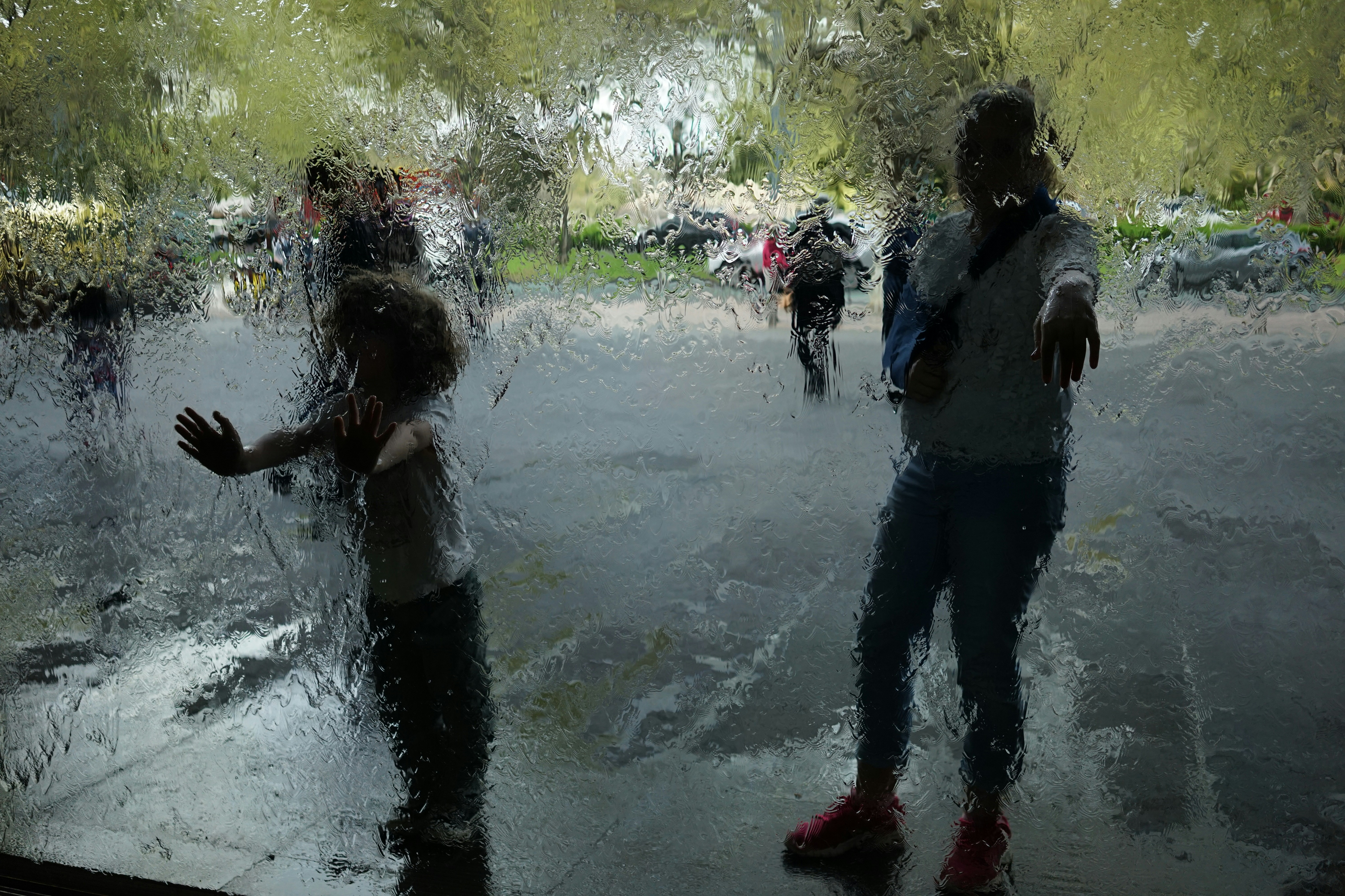 A group of people playing in the rain photo – Free Car Image on Unsplash