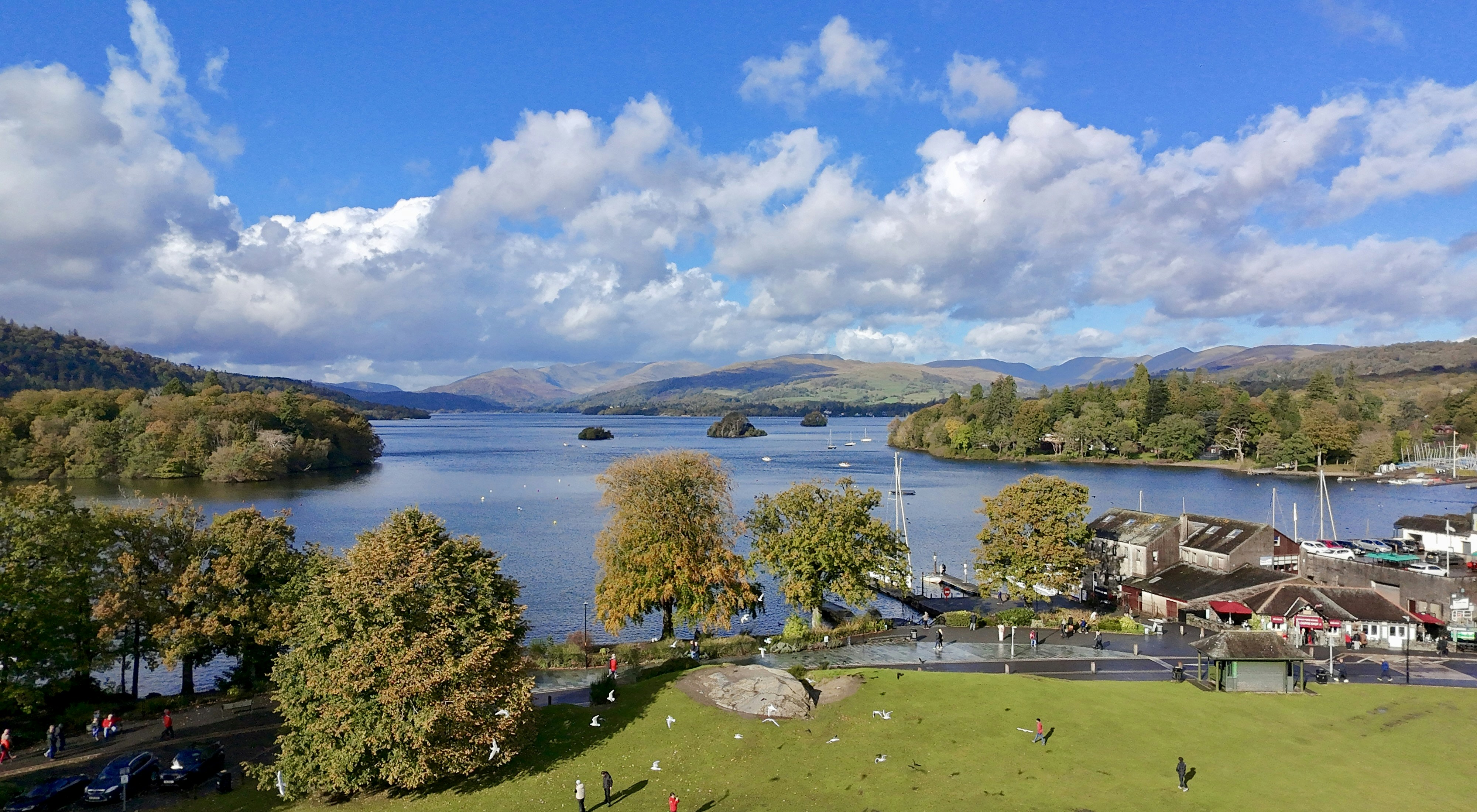 An aerial view of a lake surrounded by trees photo – Free Windermere ...