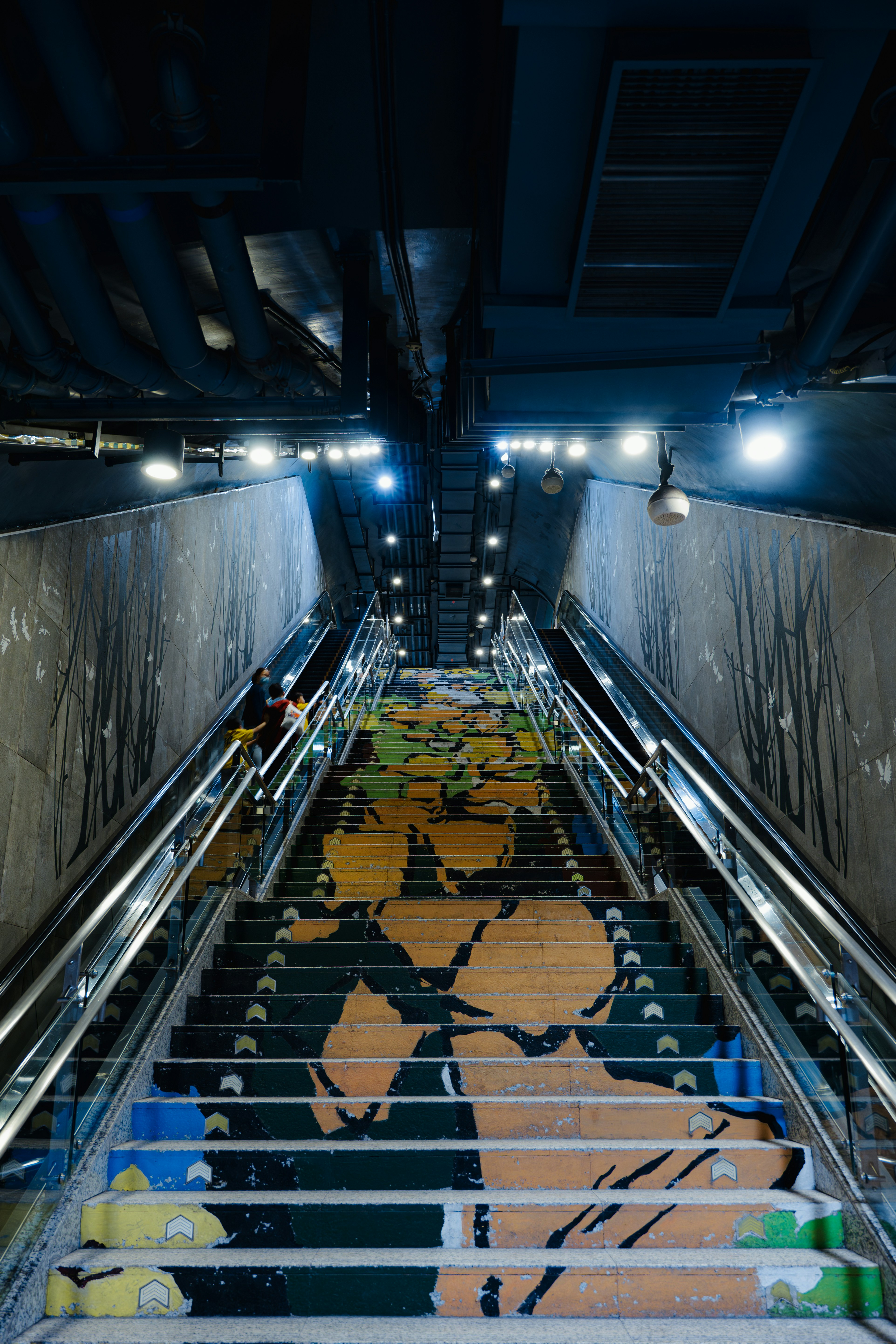Downward Collision: Neon-lit Graffiti Staircase Reaching for the Ceiling