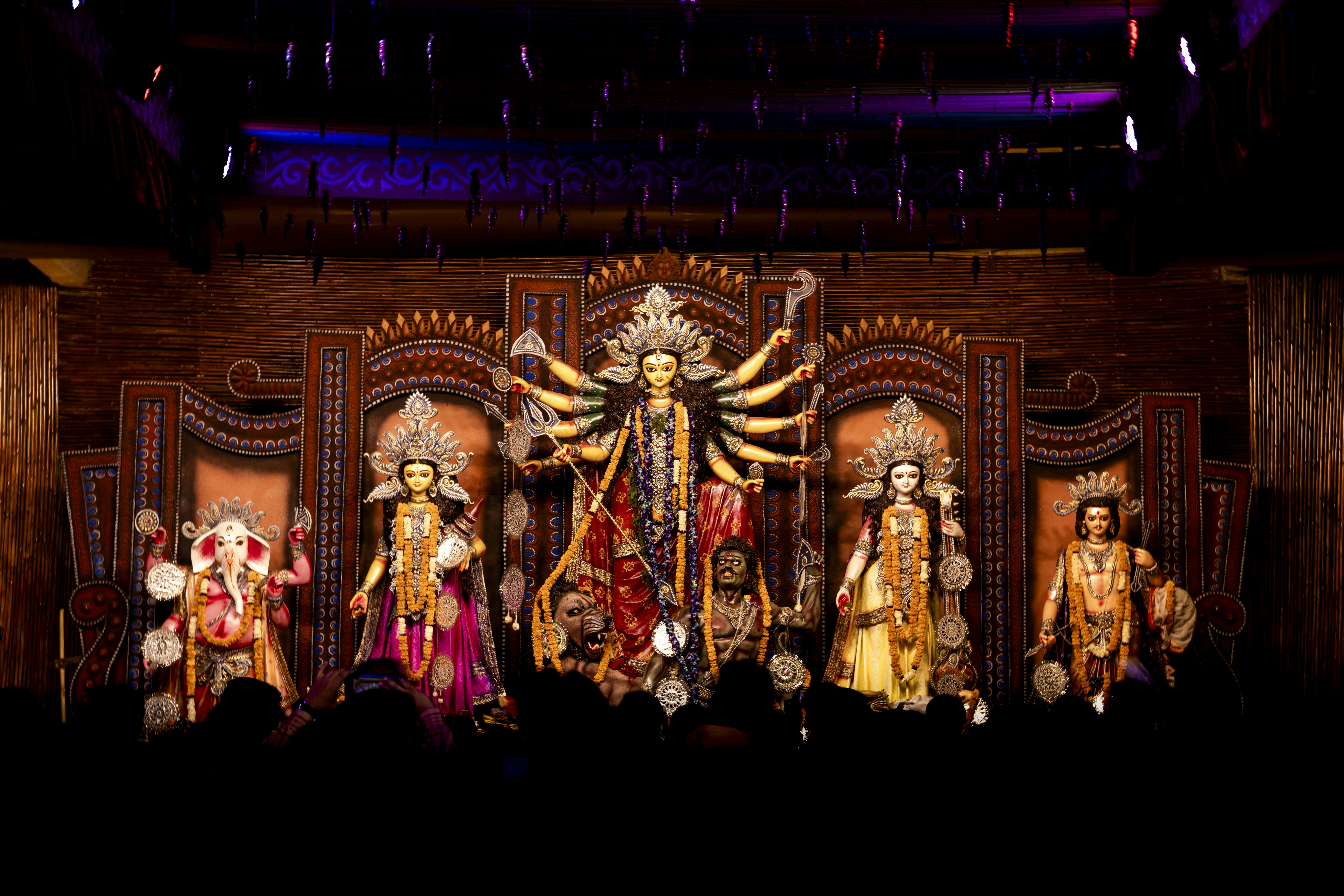 A group of people standing on top of a stage photo – Free Durga puja ...