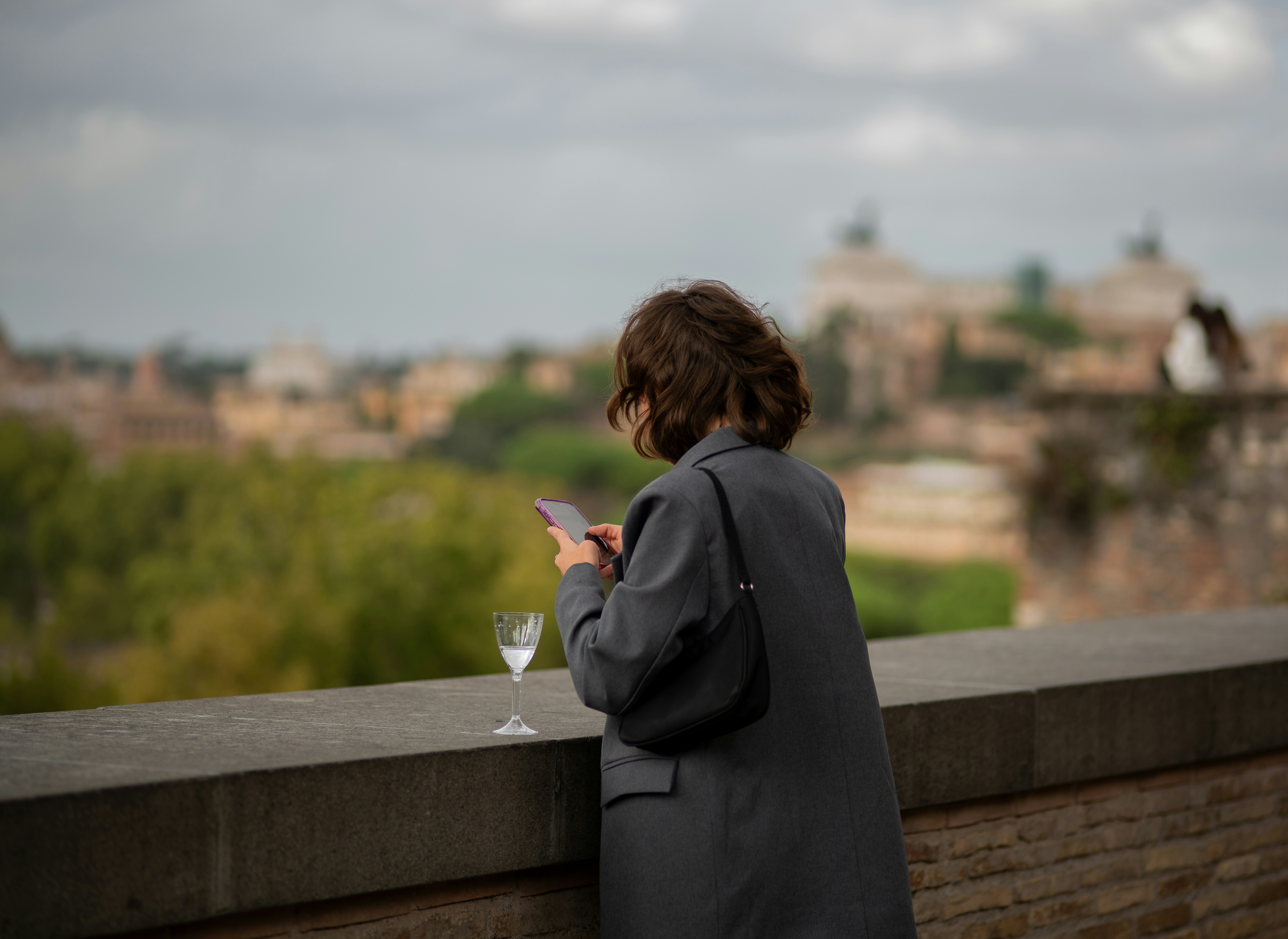Cityscape Reverie: A Quiet Moment at the Wall