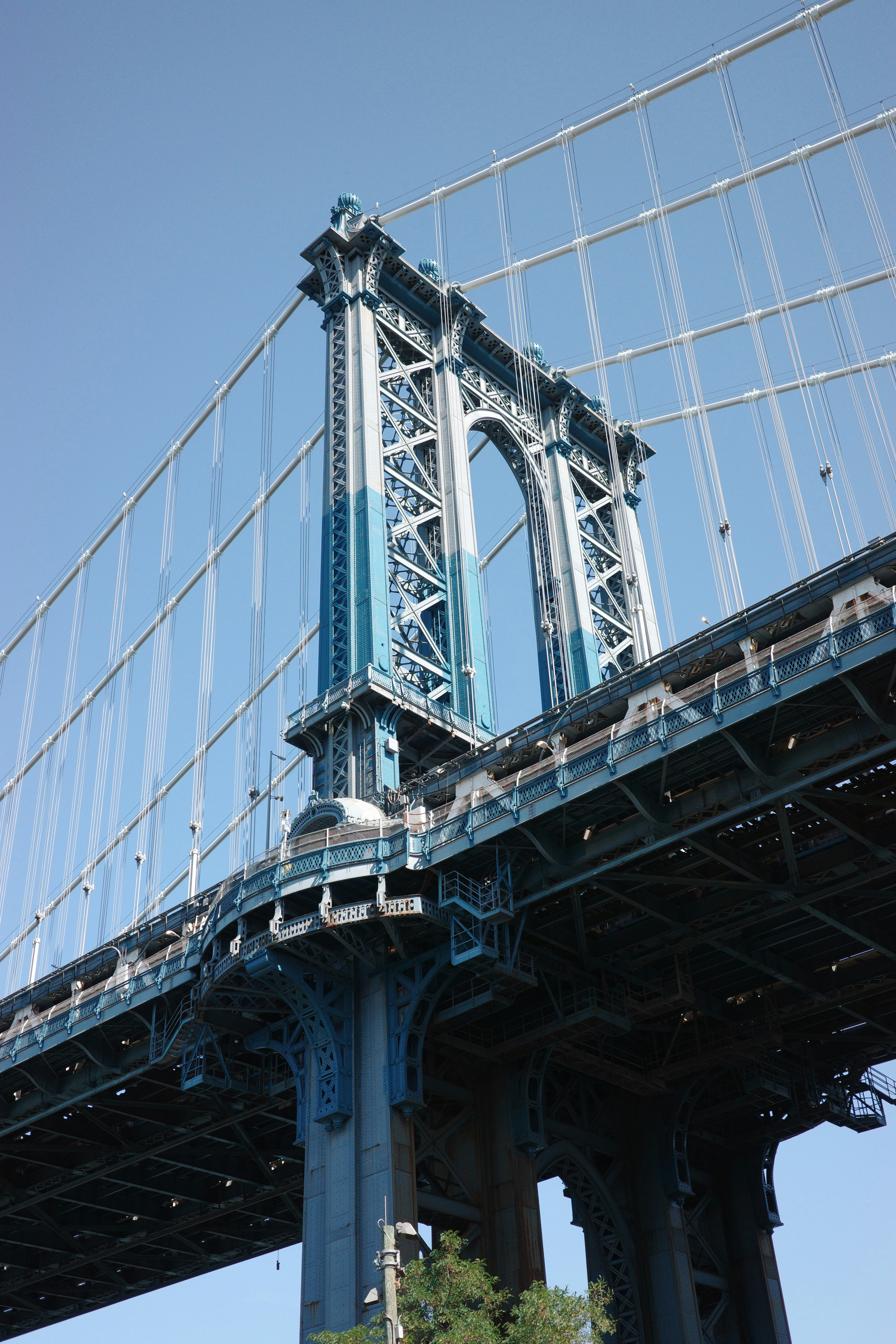 Azure Sentinel: Close-Up of a Blue Steel Suspension Tower Strung with Cables