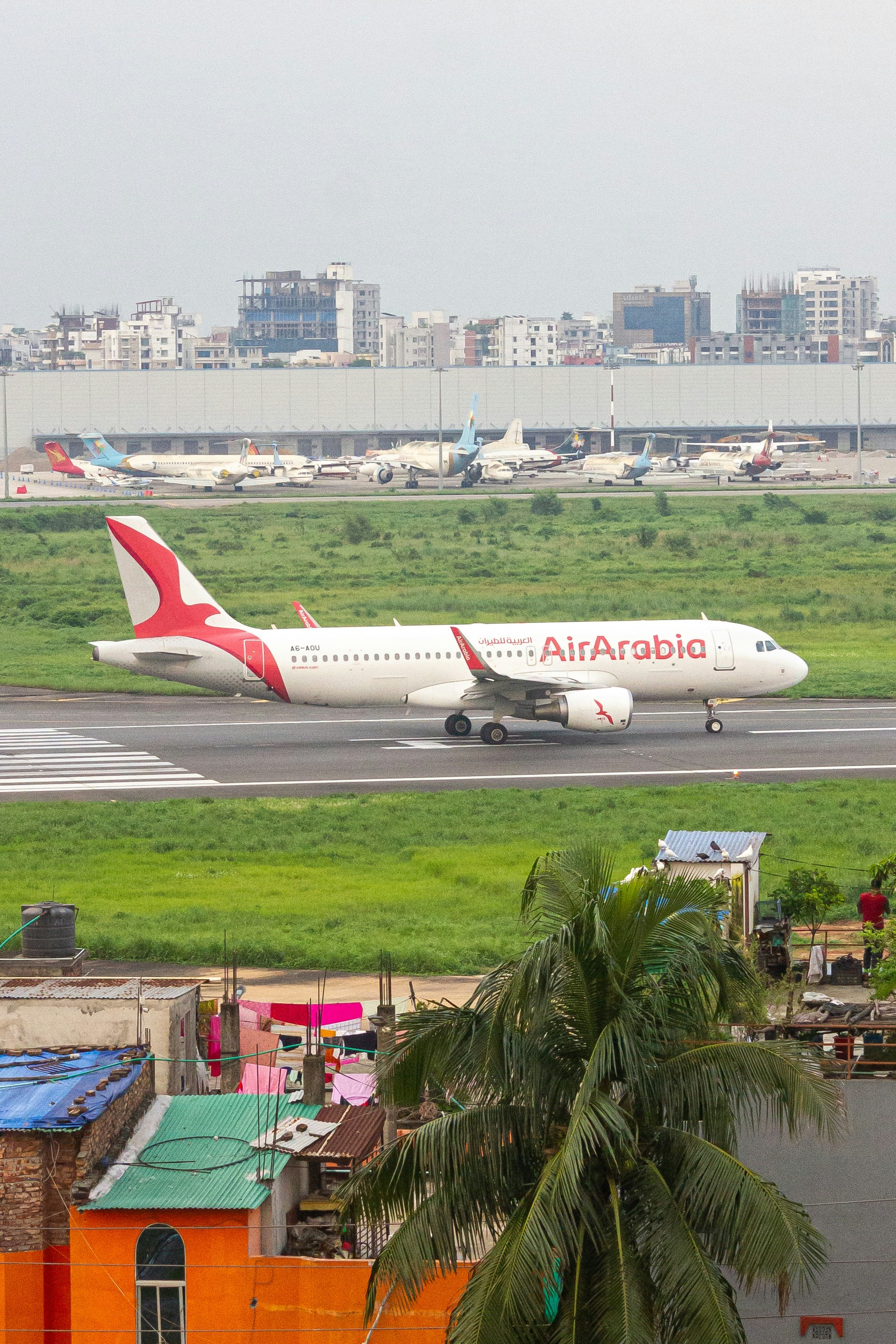 A large jetliner sitting on top of an airport runway photo – Free ...