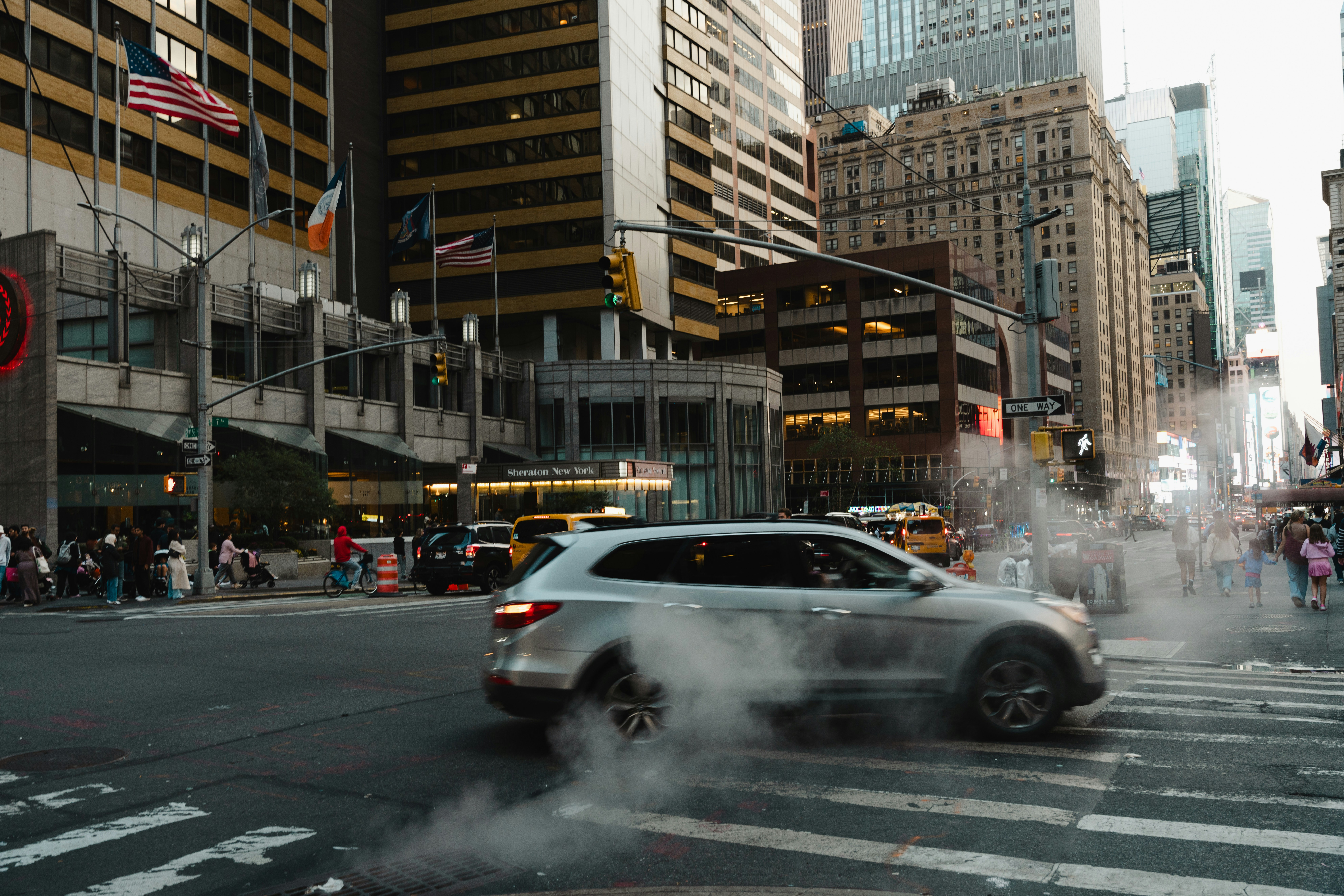 Midtown Crosswalk Blur: Steam, Speed, and Skyscrapers