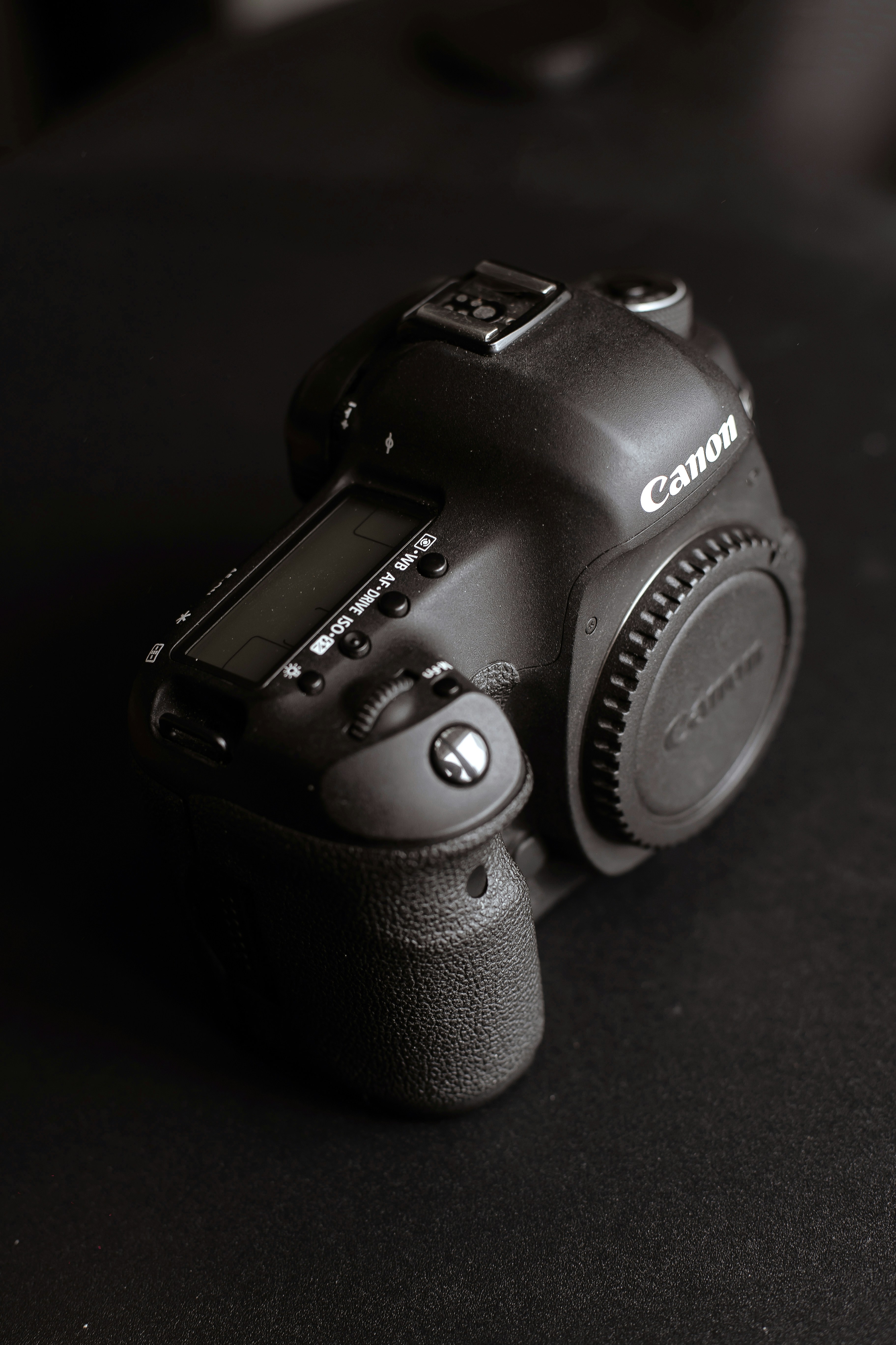 A camera sitting on top of a black table photo – Free Canon 5d mark iii ...