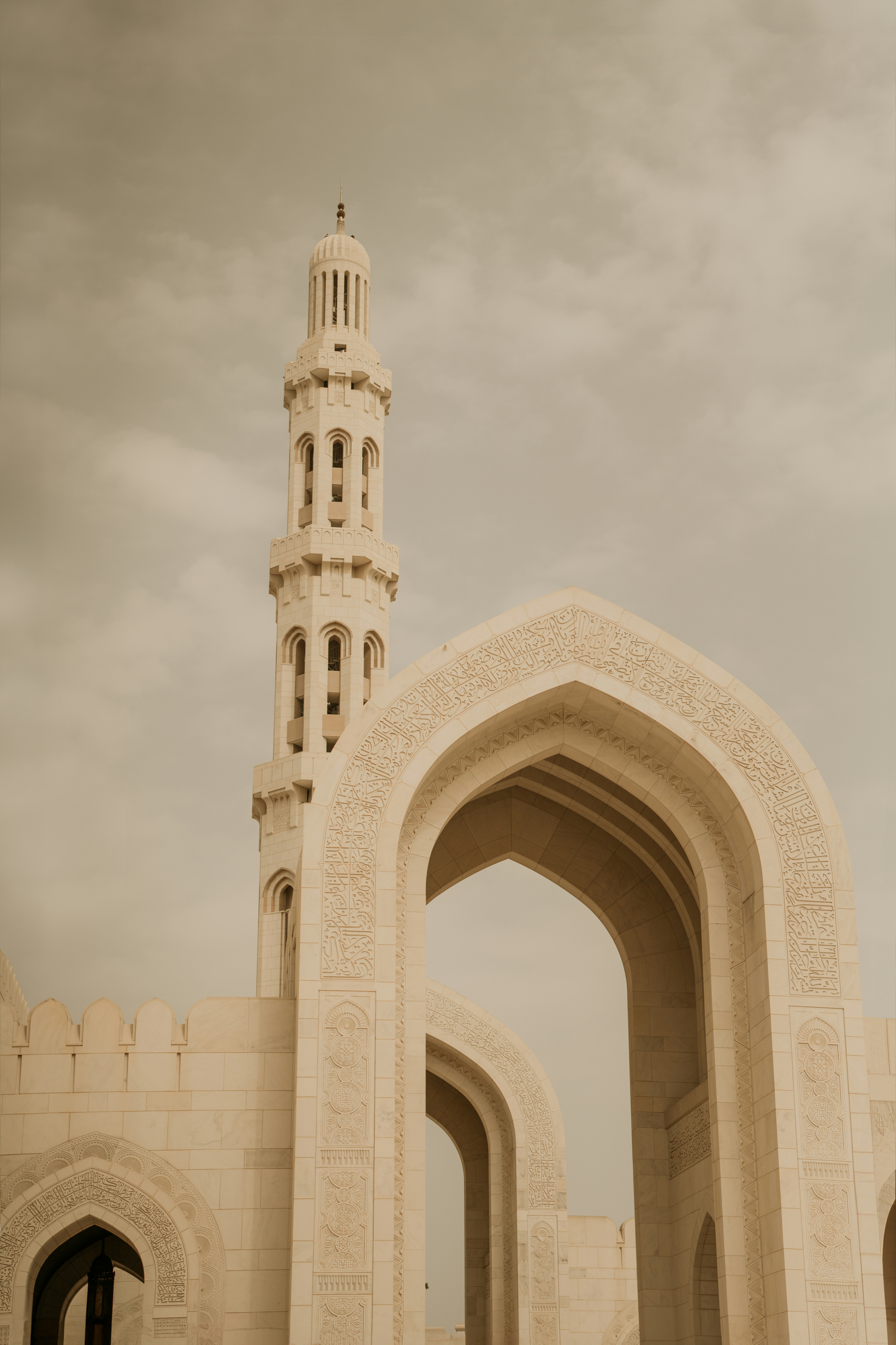 A tall white building with a clock tower in the background photo – Free ...
