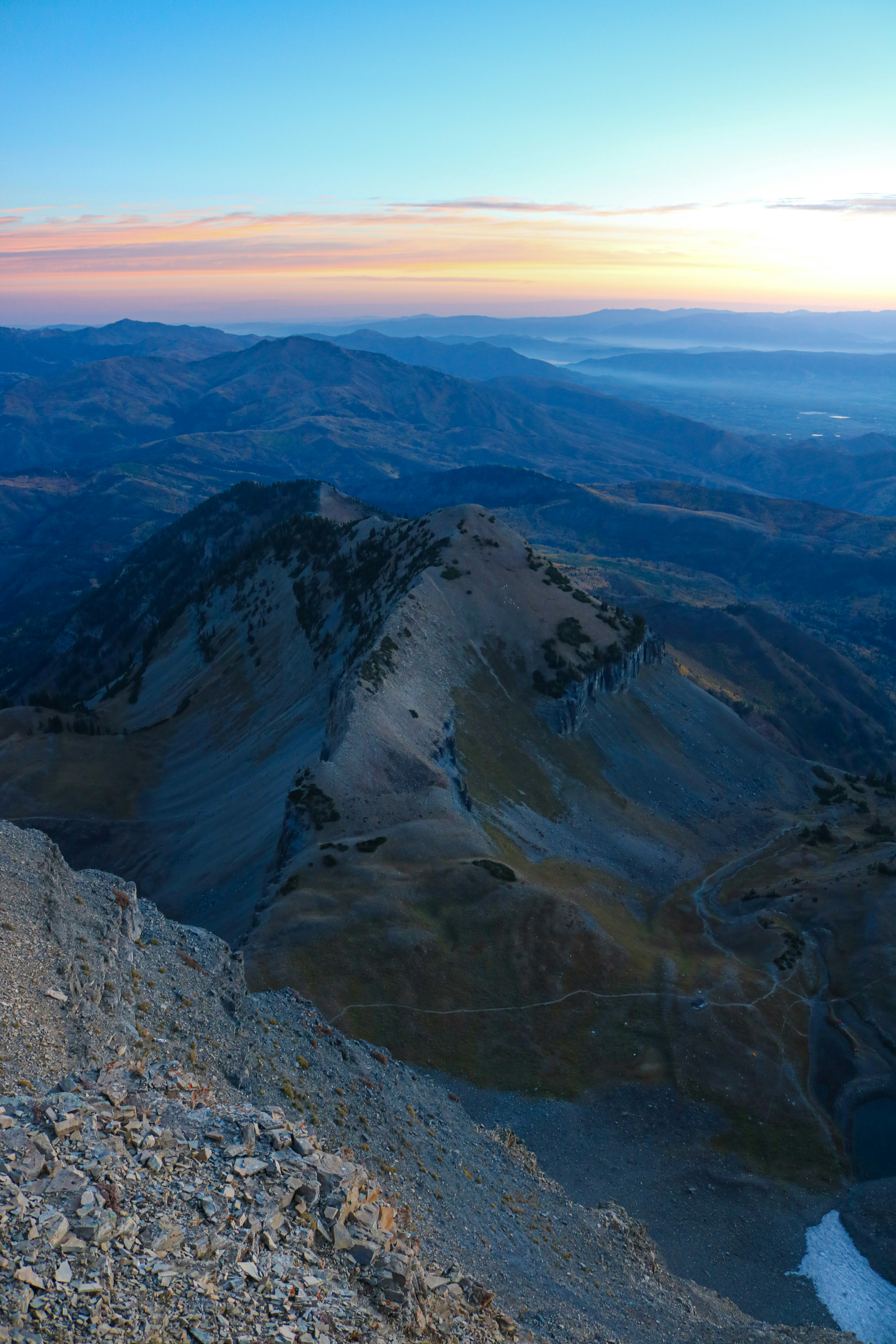 Edge of the World: Sunset Veil over Rugged Peaks