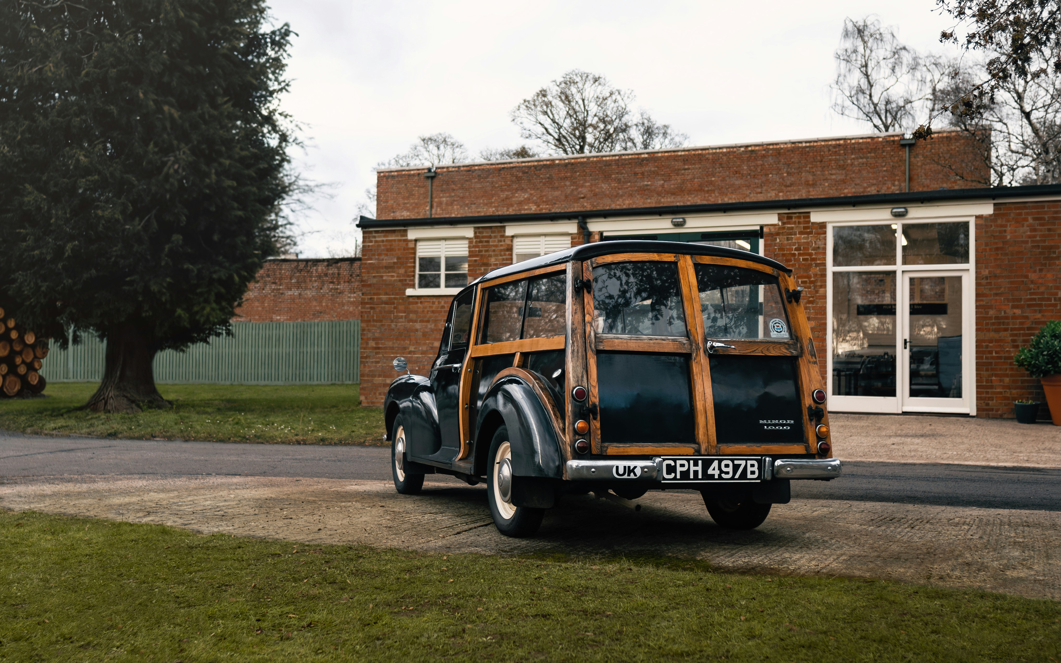 A car parked in front of a brick building photo – Free Bicester ...