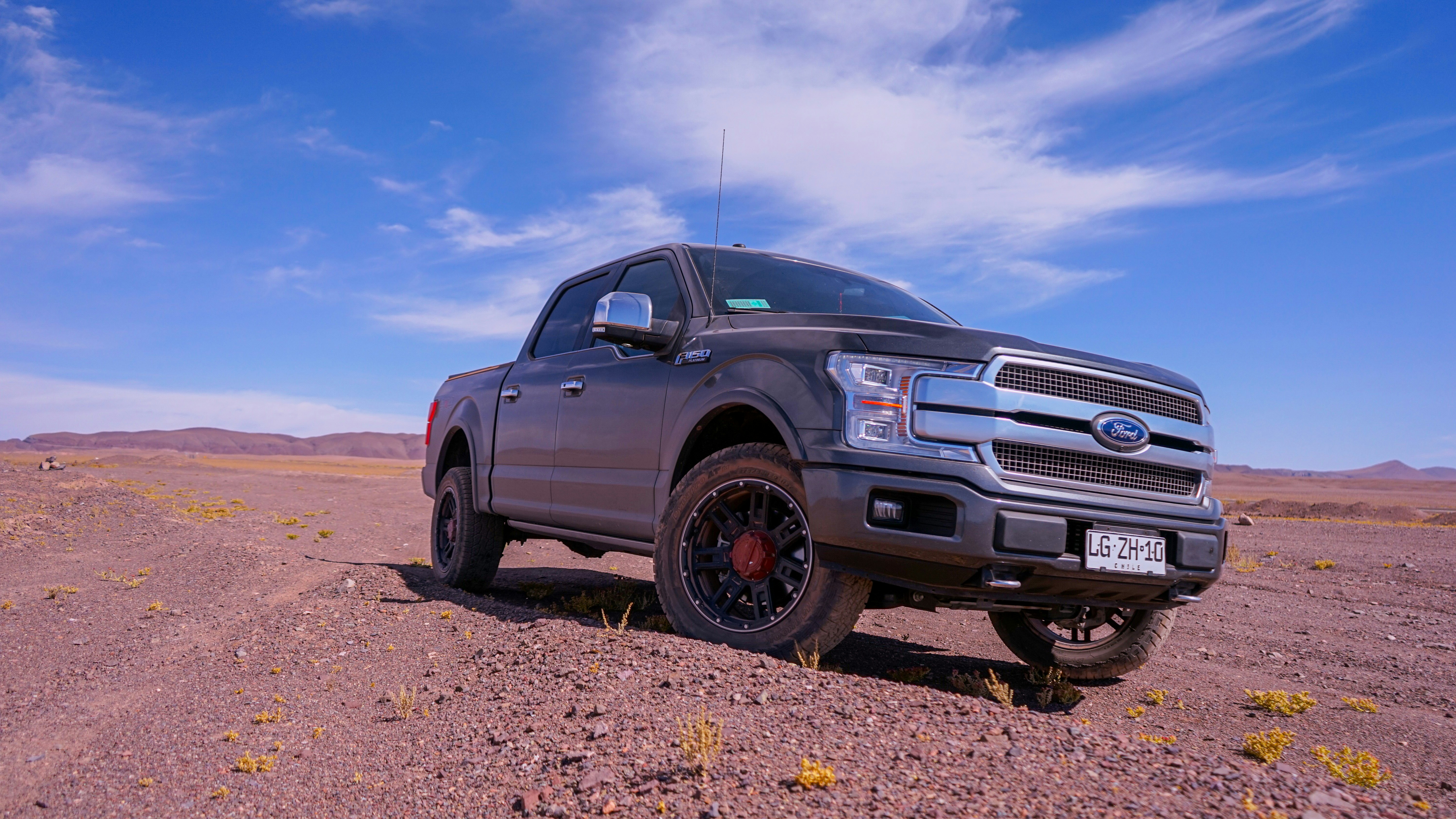 Desert Expedition: Rugged Truck Under Vast Skies