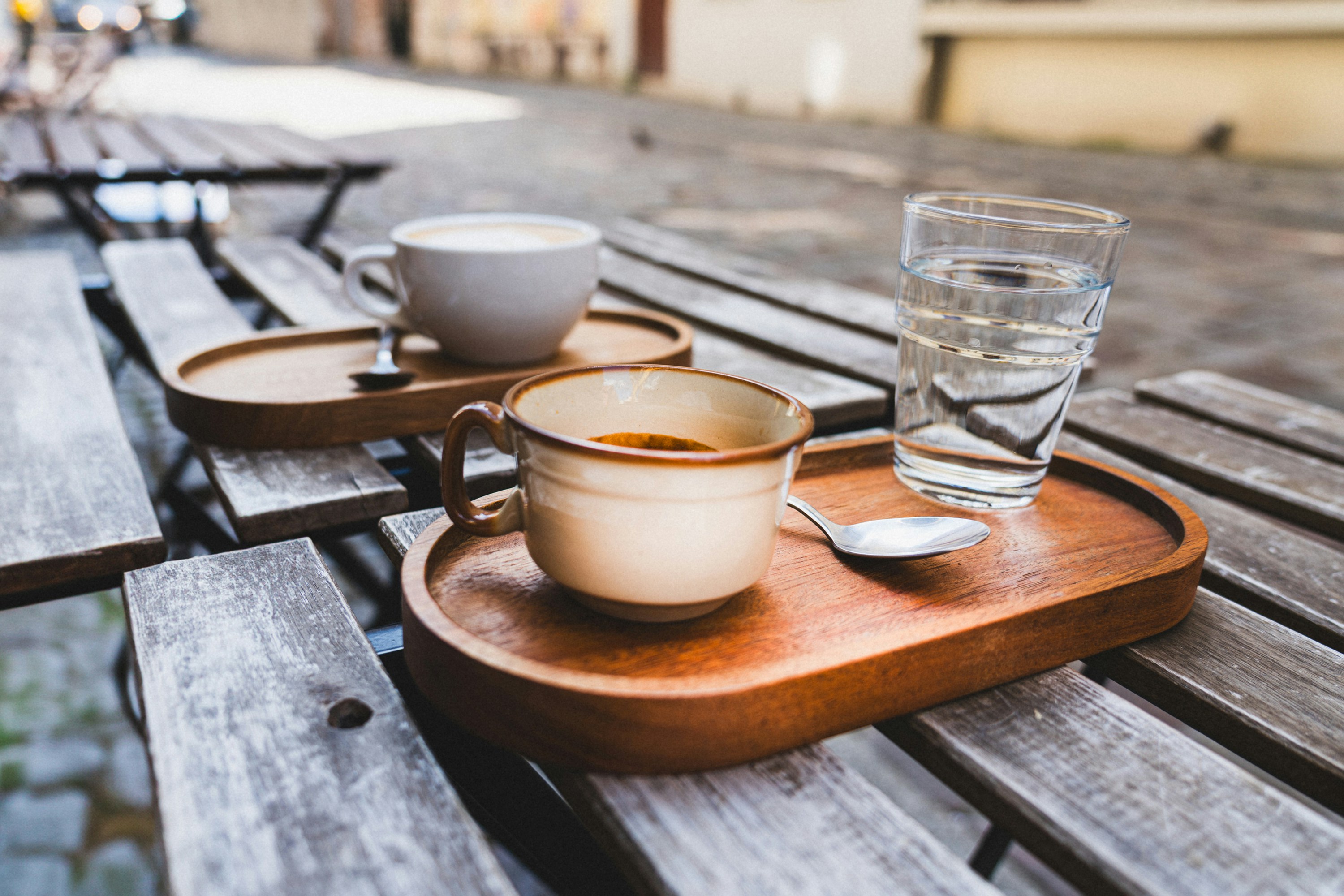 A wooden table topped with cups and saucers photo – Free Cup Image on ...