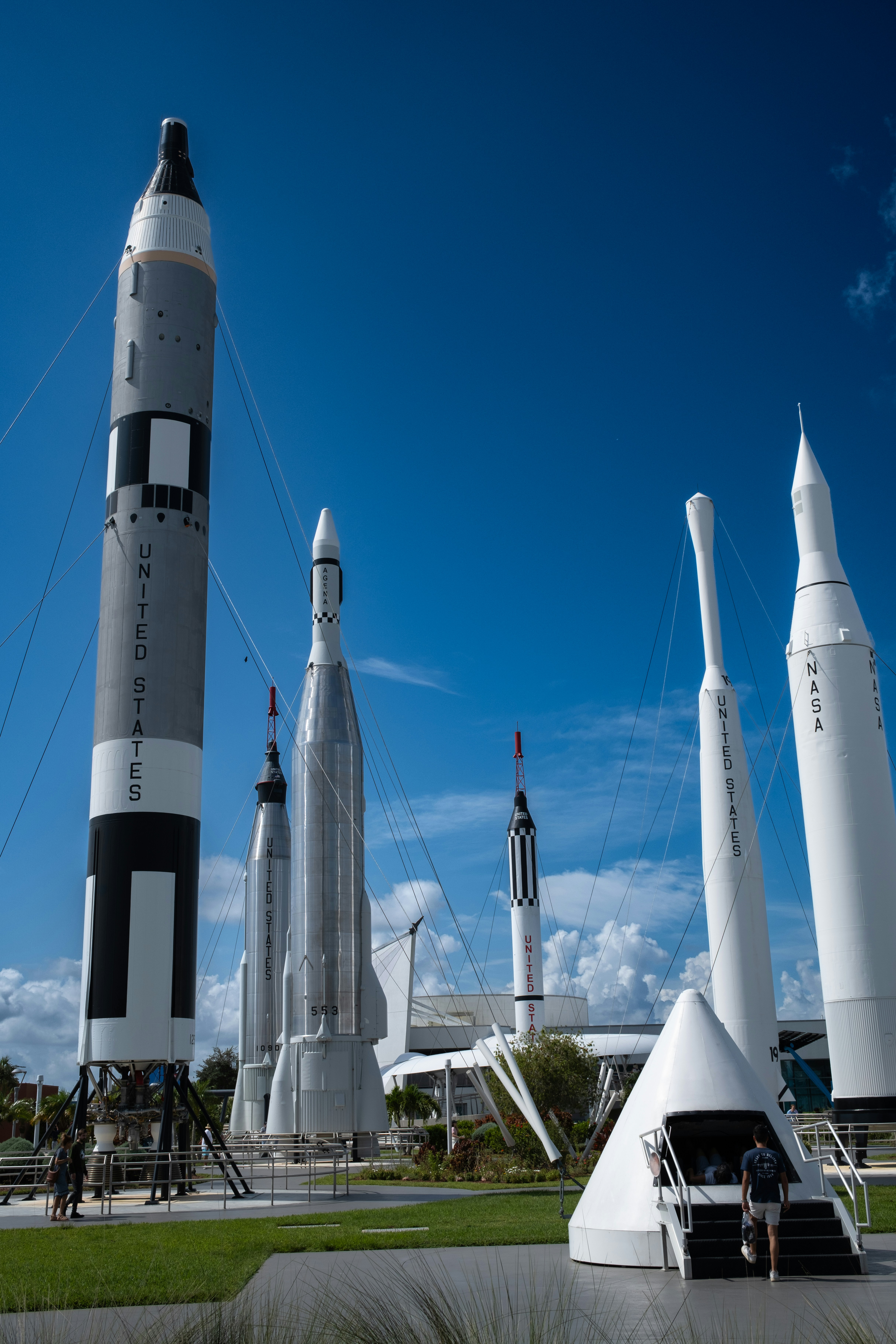 A group of rockets sitting on top of a field photo – Free Summer Image ...