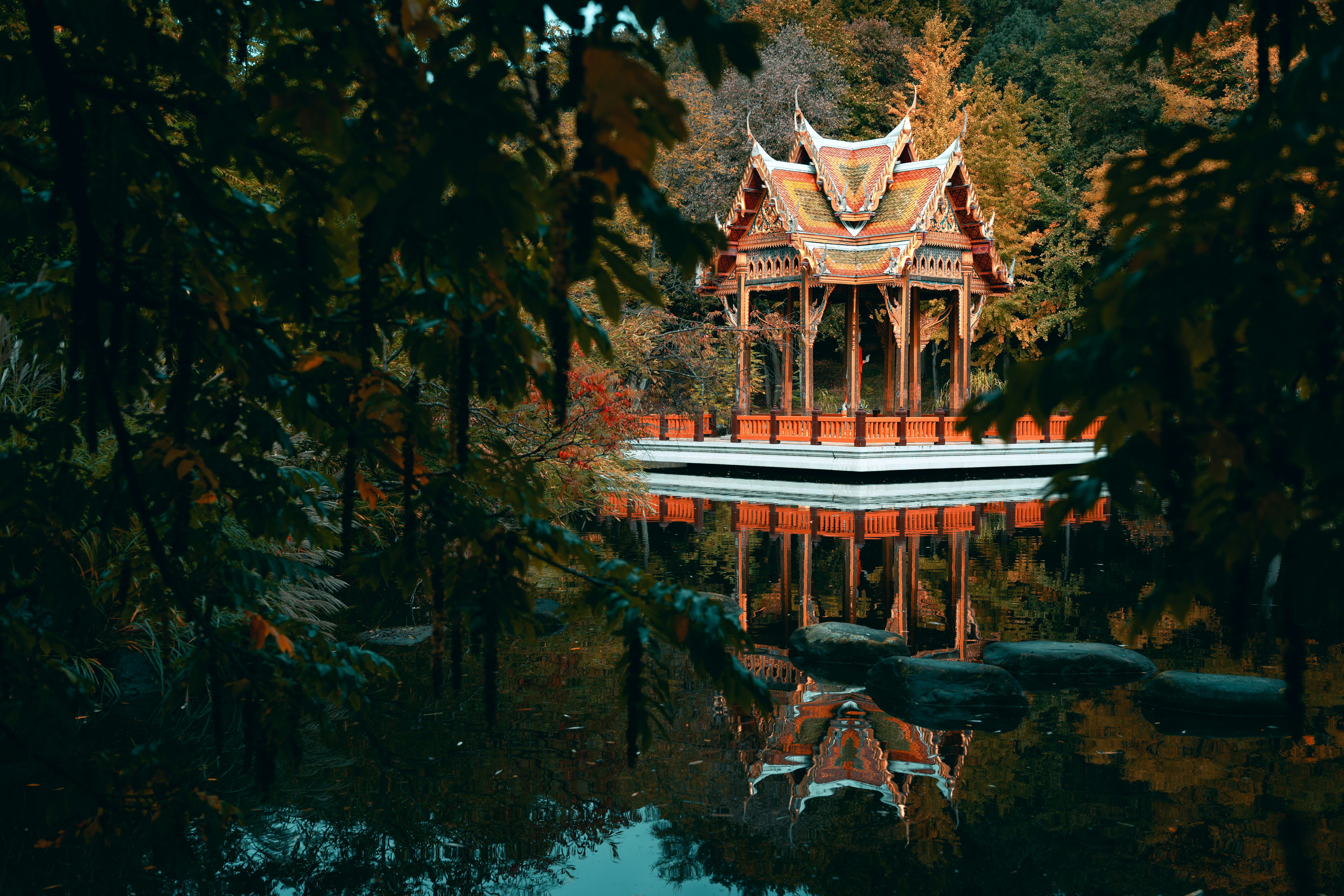 Floating Pavilion Above a Glassy Pond: Autumn Reflections