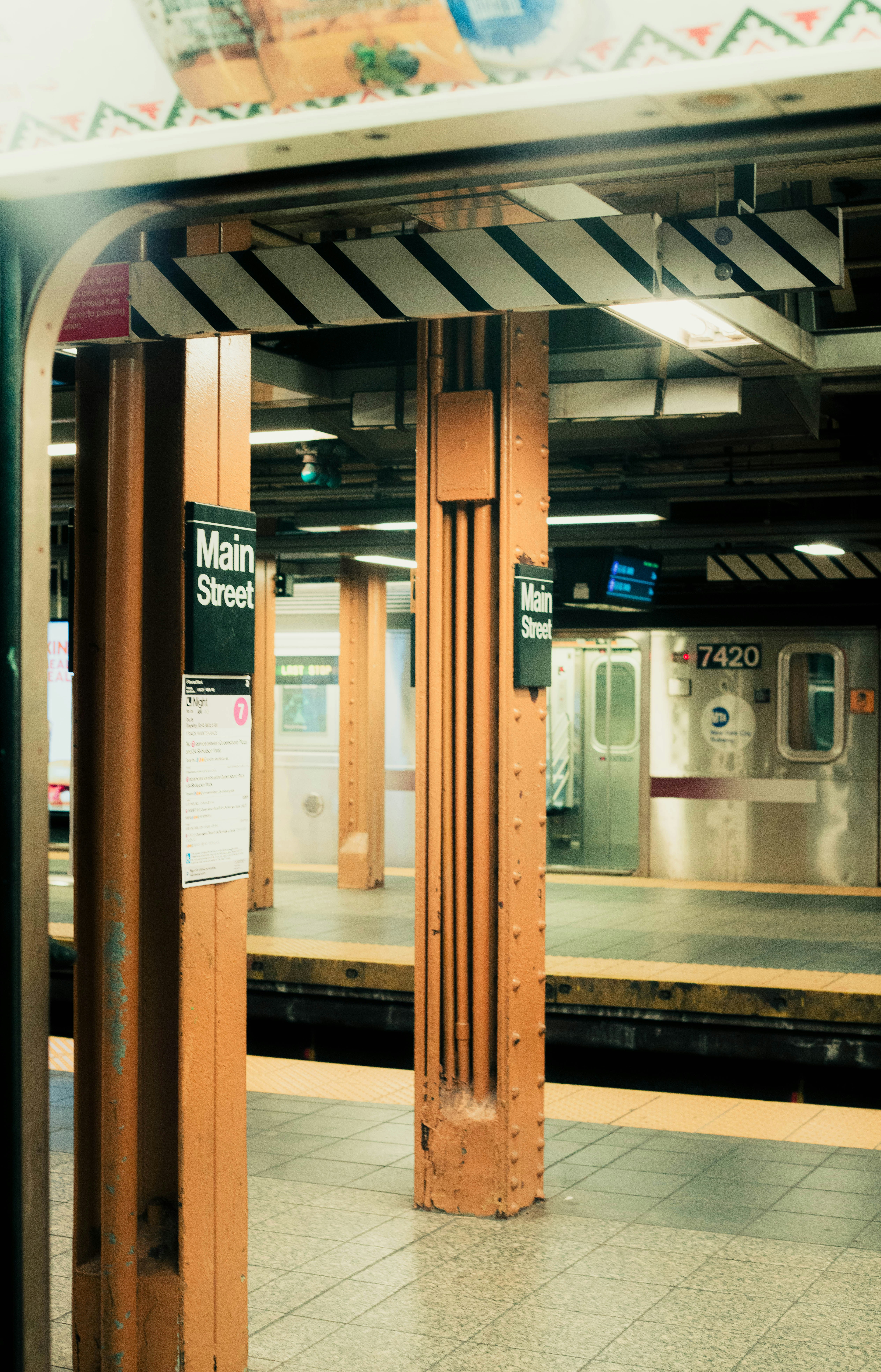 Rust-Colonnade at Main Street: Subterranean Pause Between Trains